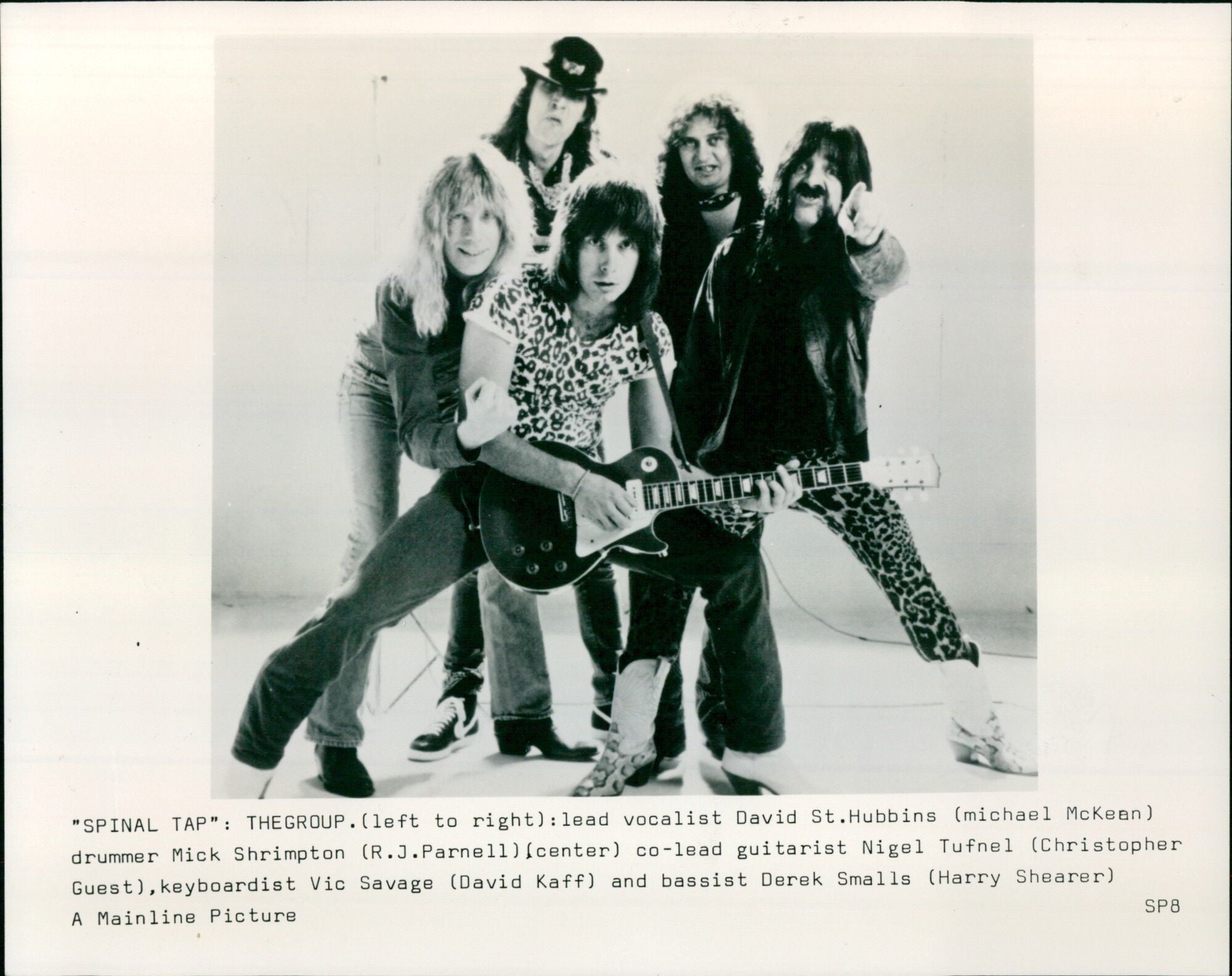 The cast of the cult classic "This Is Spinal Tap" poses for a photo.