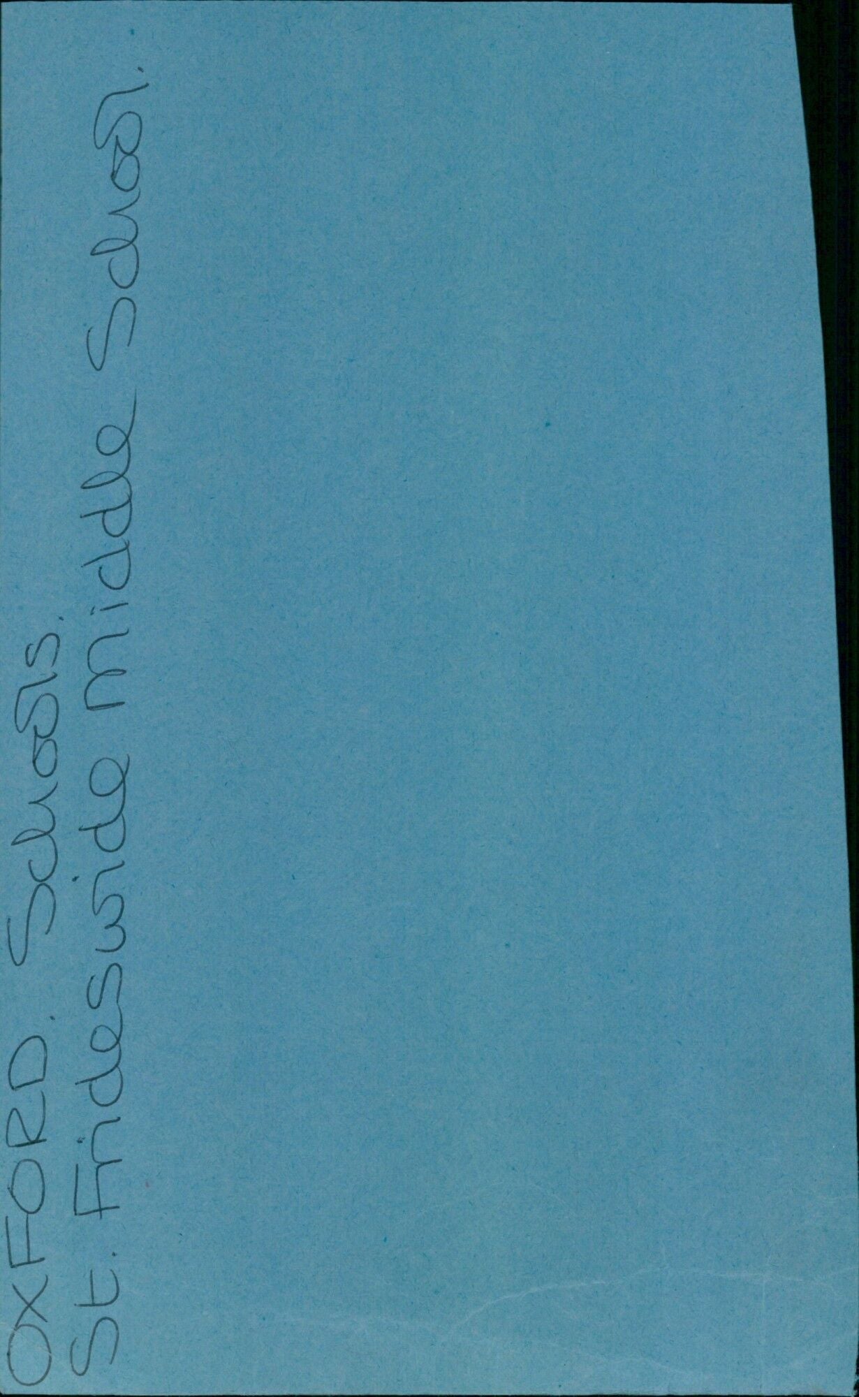 A group of sixth graders wearing face masks and socially distancing du