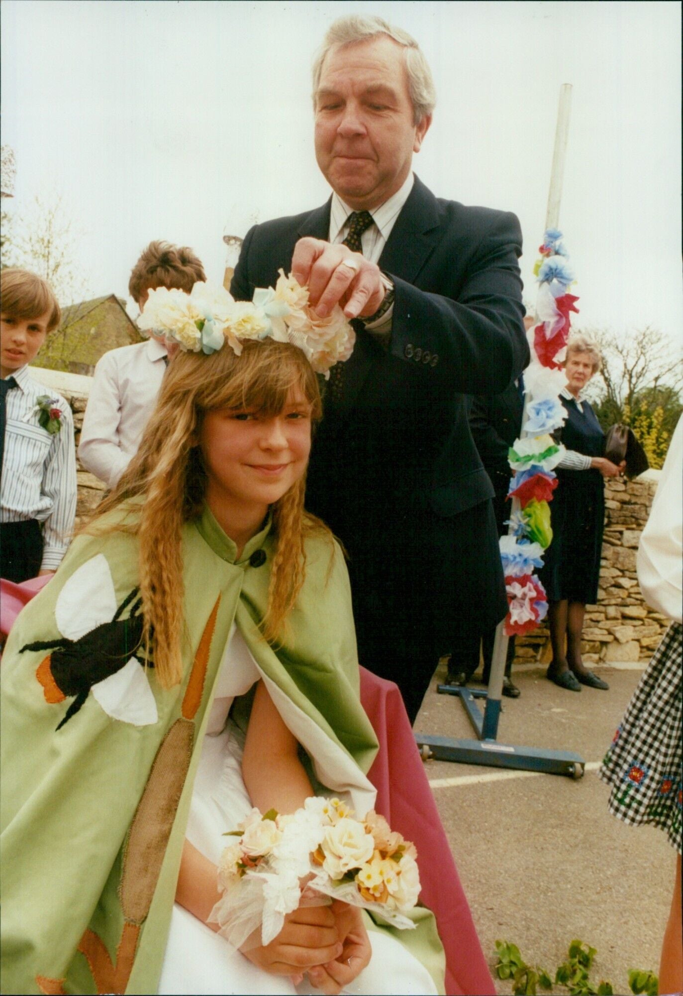 May Queen Vicky Beesley is crowned at a May Day celebration at Blechin