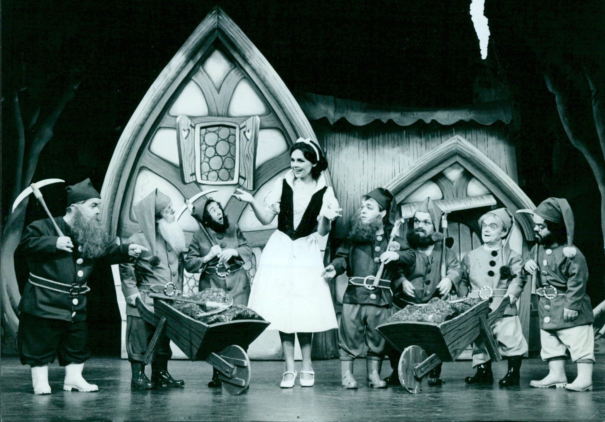 Cast members of the Apollo Theatre pantomime, Snow White, pose for a p