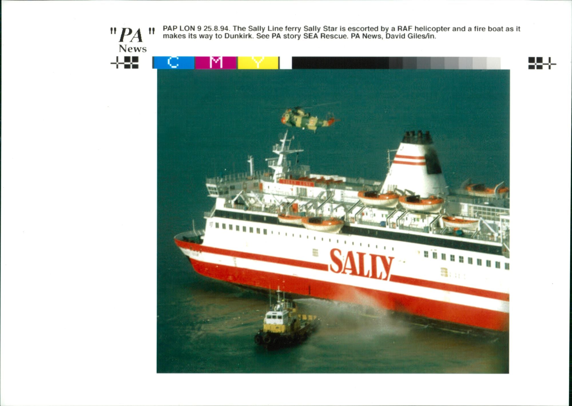 The Sally Line ferry Sally Star is escorted by a RAF helicopter and a