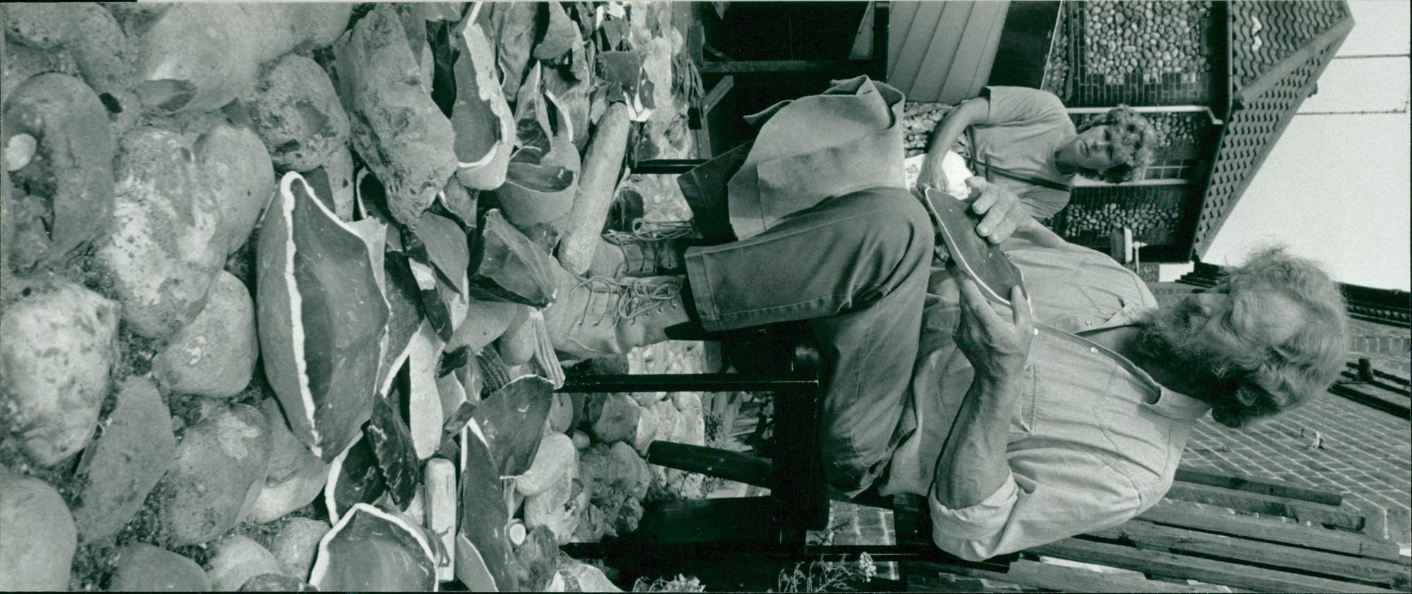 john lord demonstrates at cromer museum how stone age people made axes