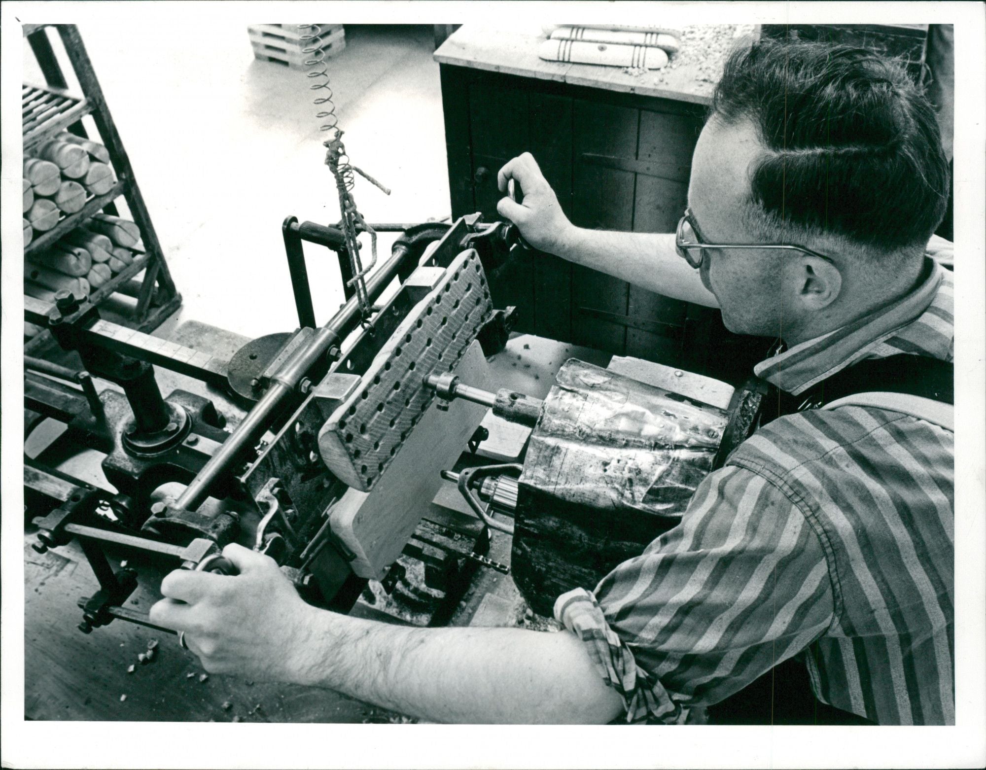 At work on the semi-automatic boring machine is Mr. Frank Westwood.