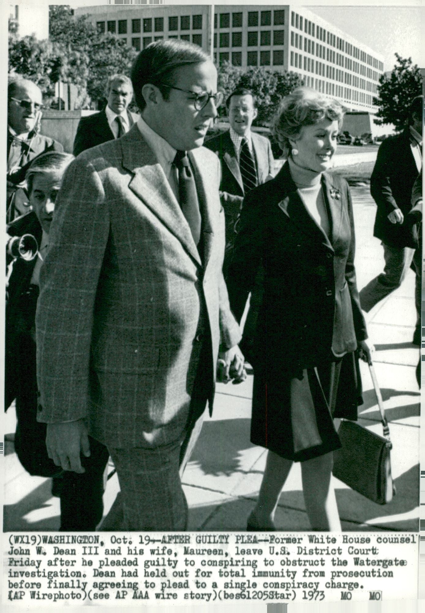 John Dean leaves the district court with his wife Maureen after being