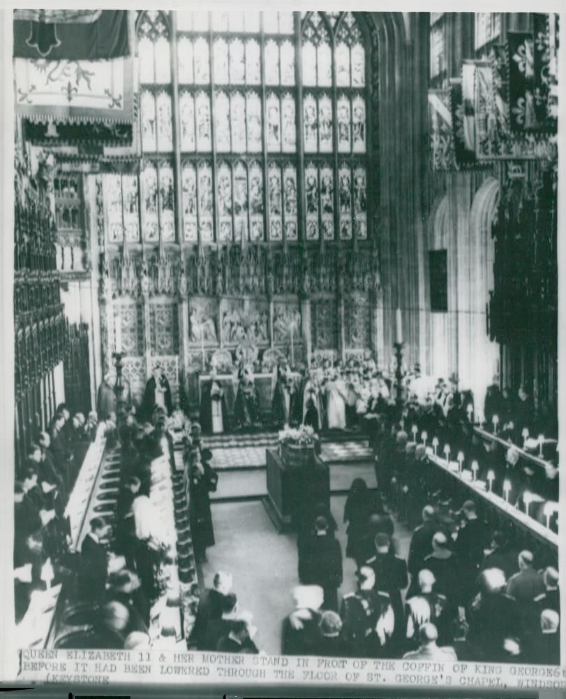 Queen Elizabeth II and Queen Mother stand in front of King George VI c