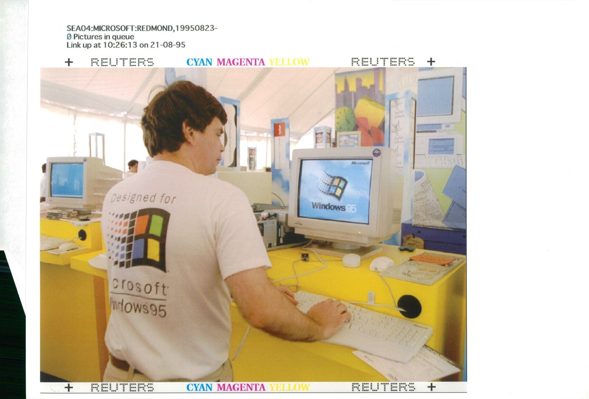 Windows '95 program as he sets up his company's exhibit. - Vintage Pho