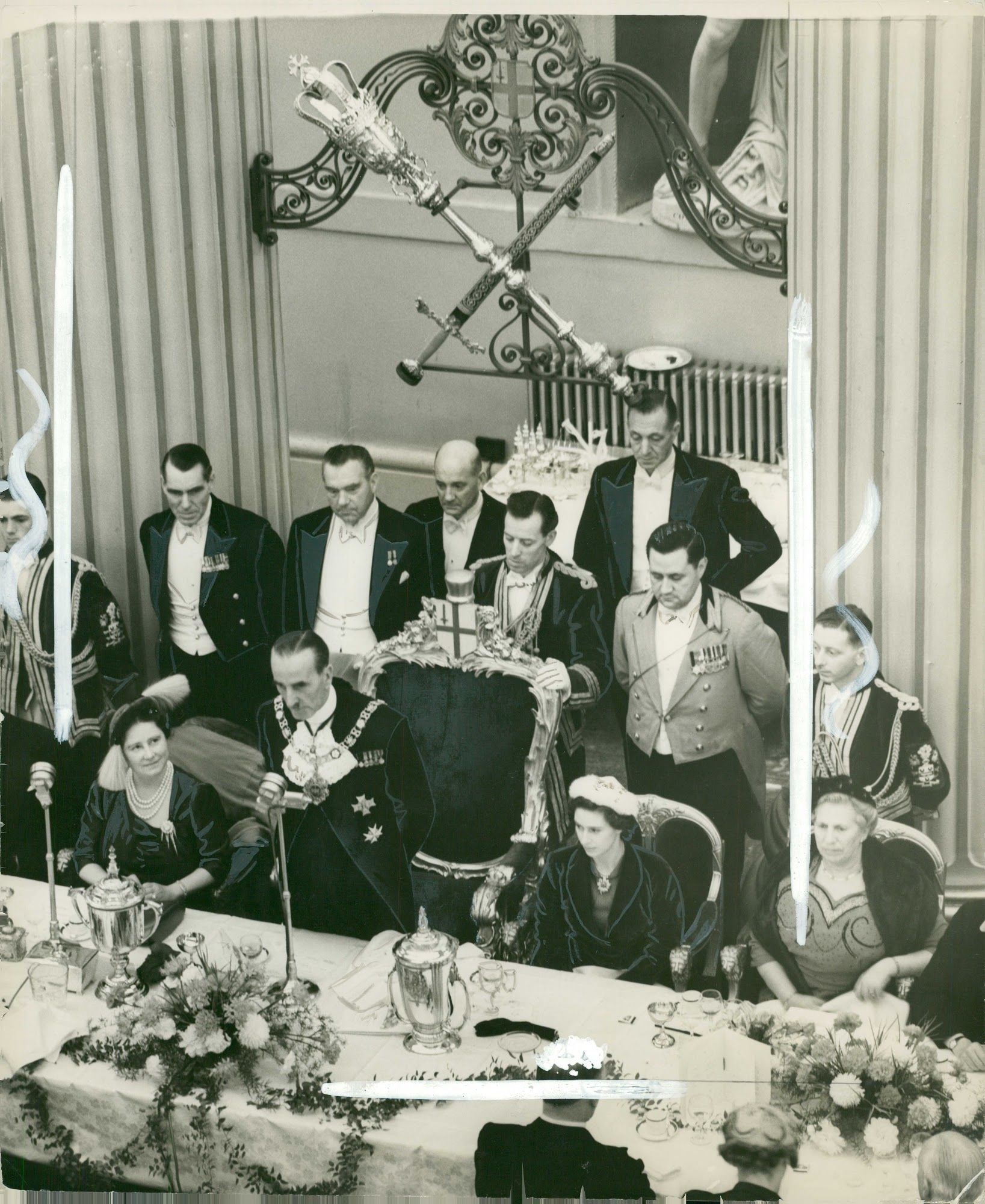 The Lord Mayor gives the toast and below are Queen Elizabeth The Queen