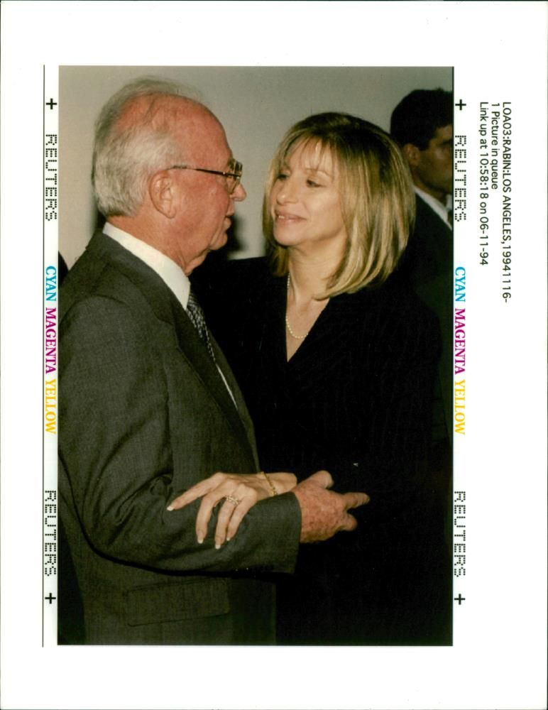 Actress Barbra Streisand hugs Israeli Prime Minister Yitzhak Rabin.