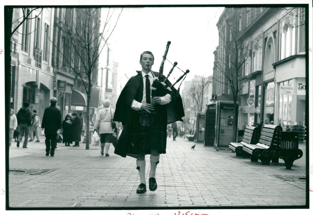 musical instruments bag pipes: 10 year old piper. - Vintage Photograph