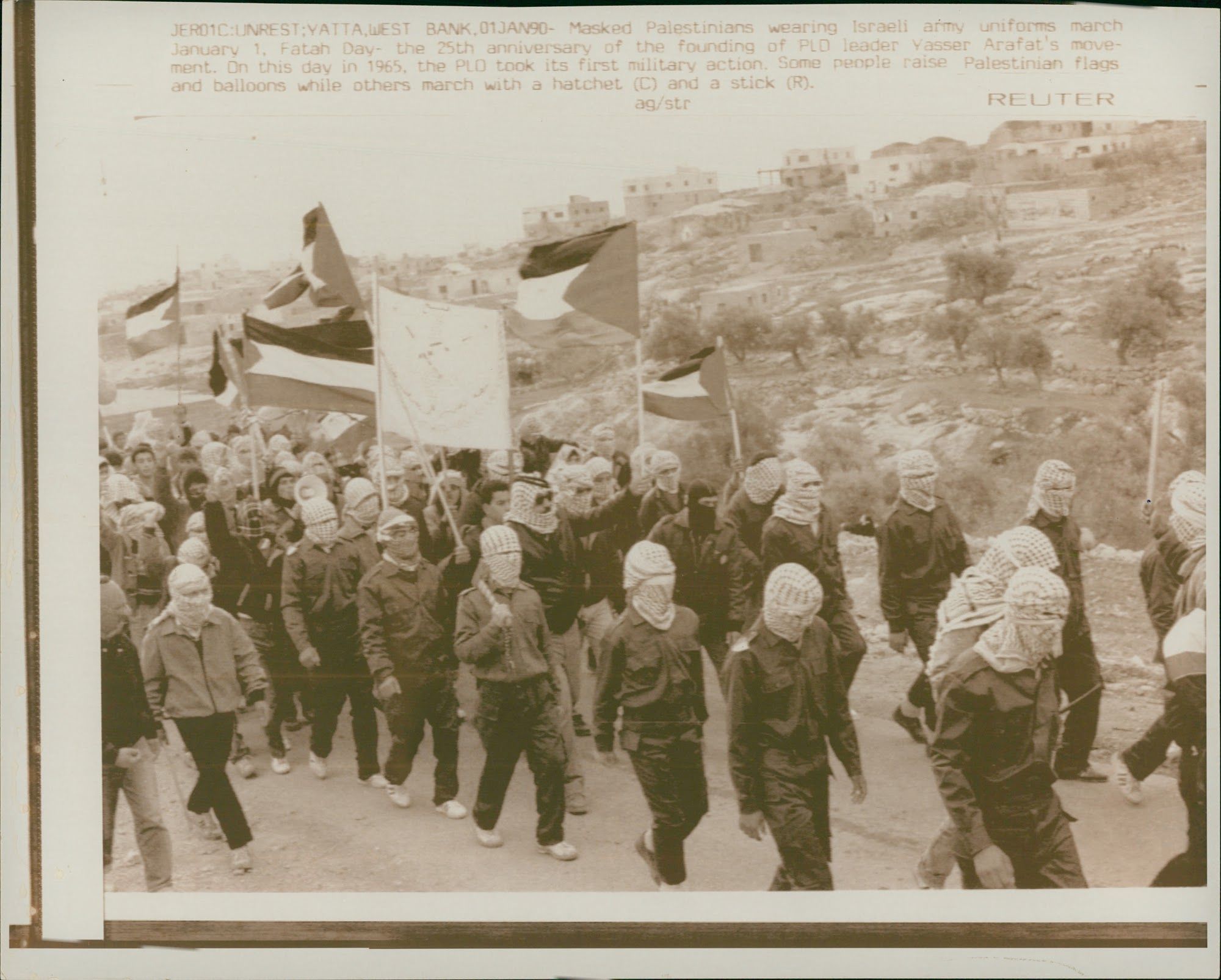 Masked palestinian wearing israeli army uniforms. - Vintage Photograph