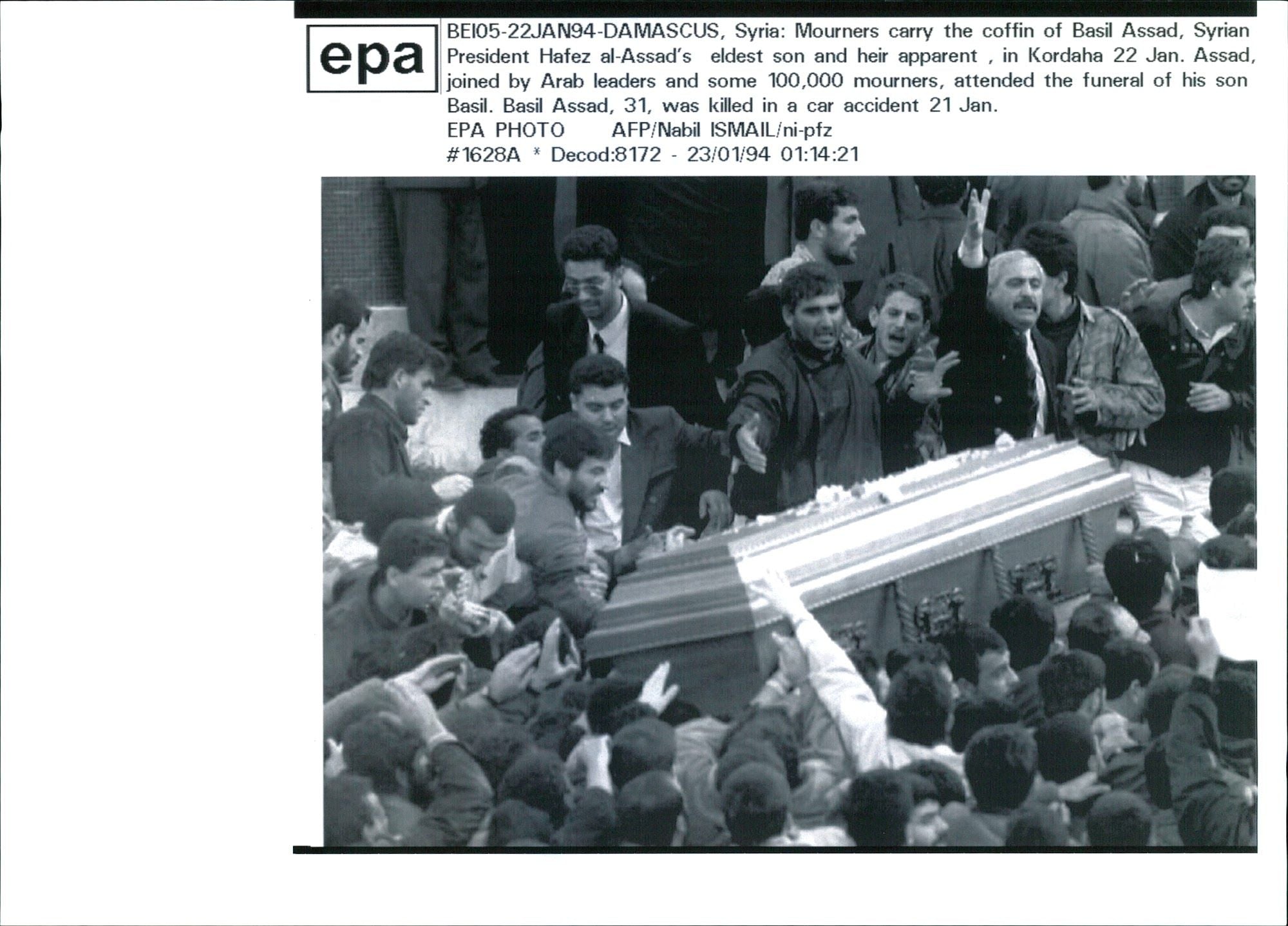 Mourners carry the coffin of Bassel al-Assad. - Vintage Photograph