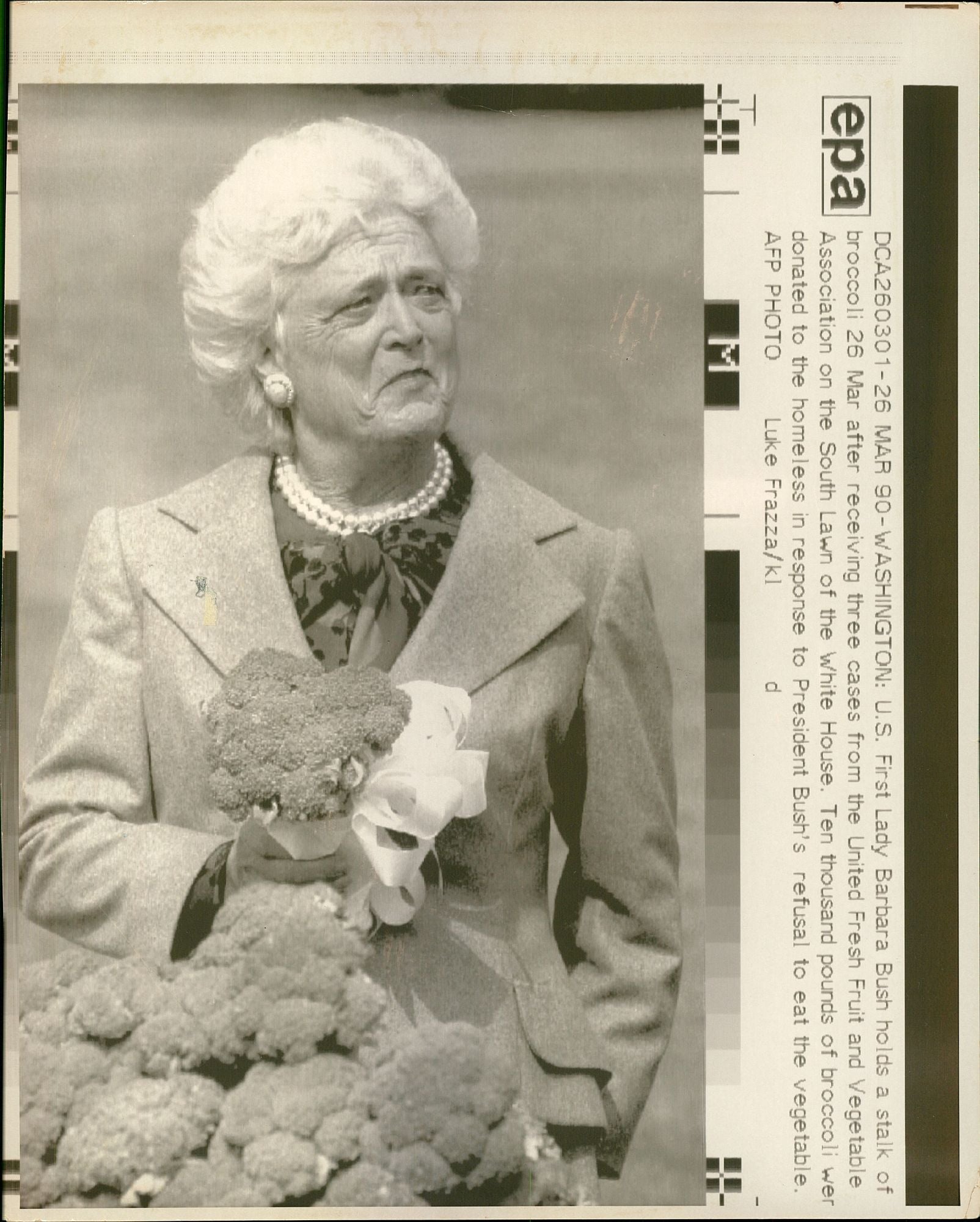 Mrs Barbara Bush, wife of President Bush receiving cases of broccoli