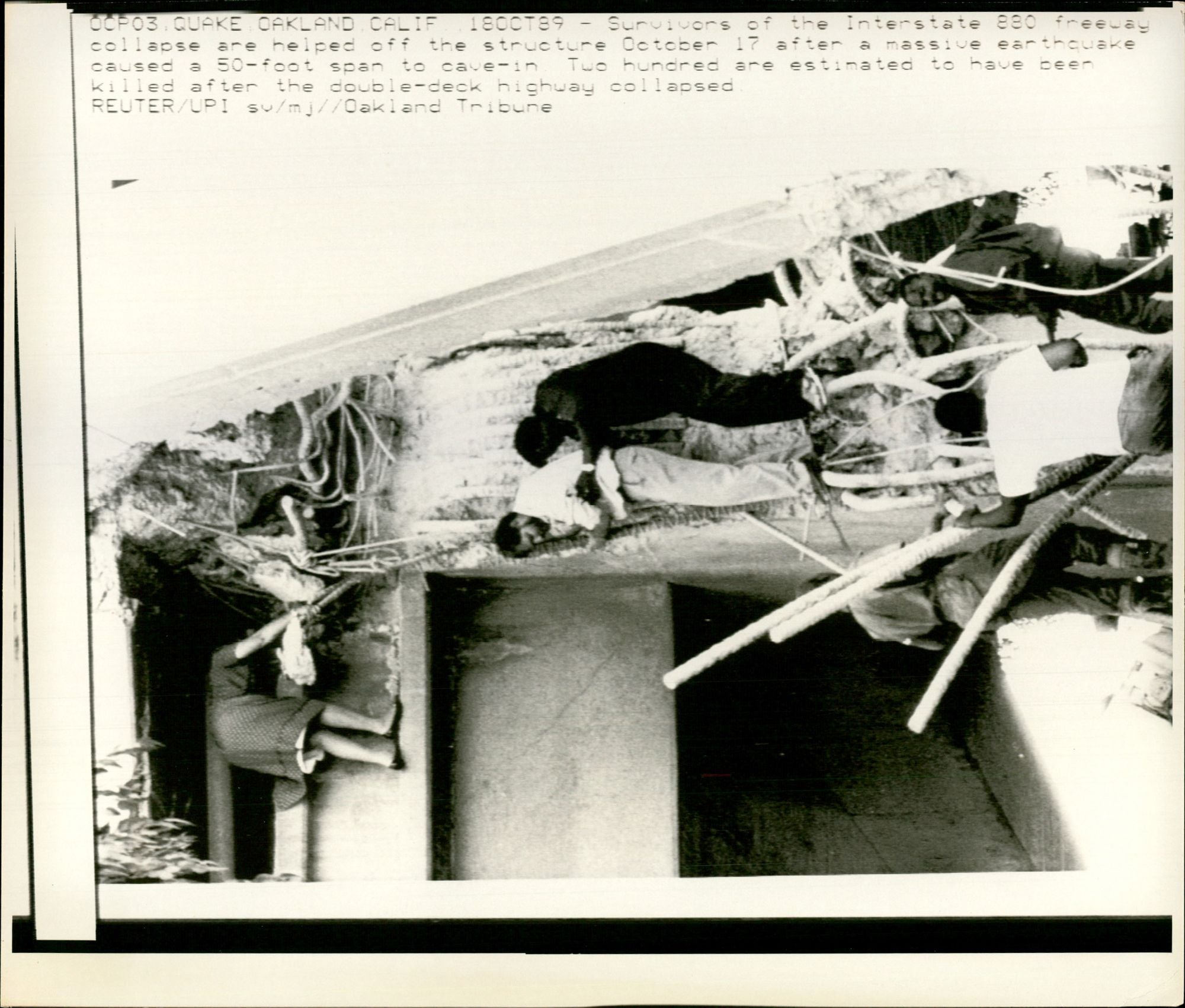 Survivors of the Interstate 880 freeway collapse are helped off the st