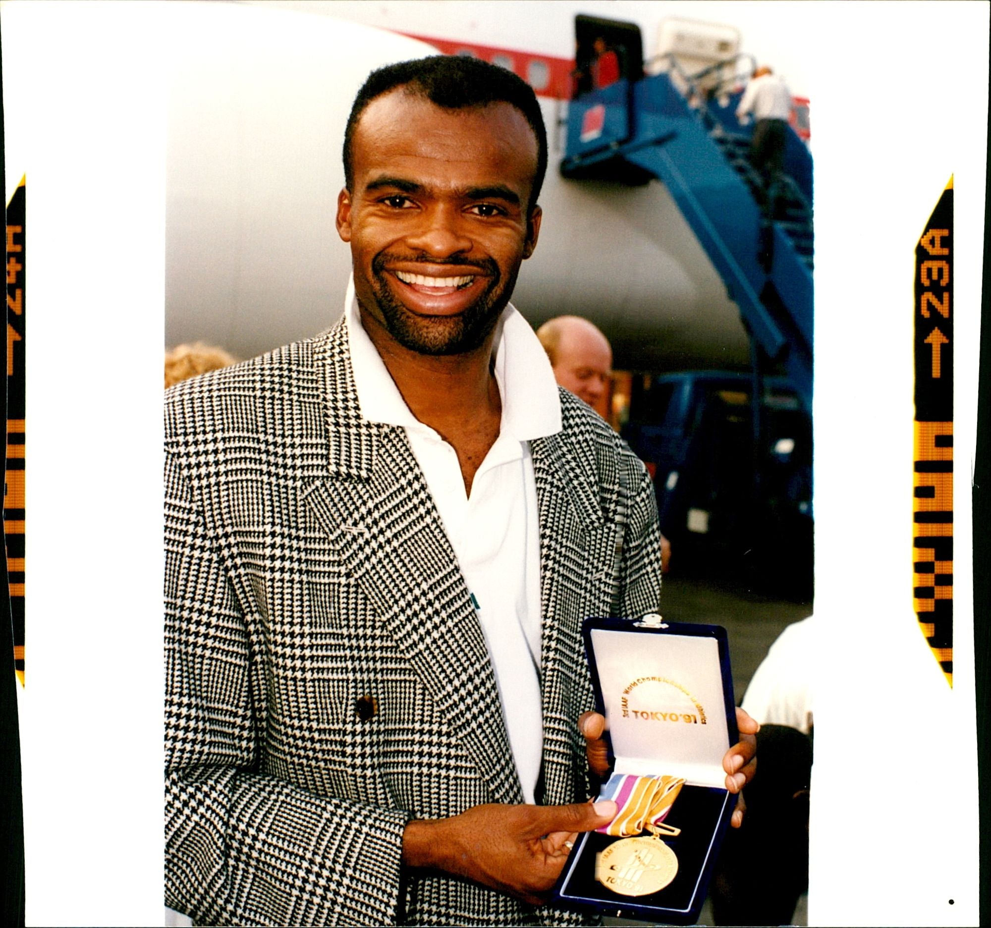 British athlete Kriss Akabusi with displays the medal - Vintage Photog