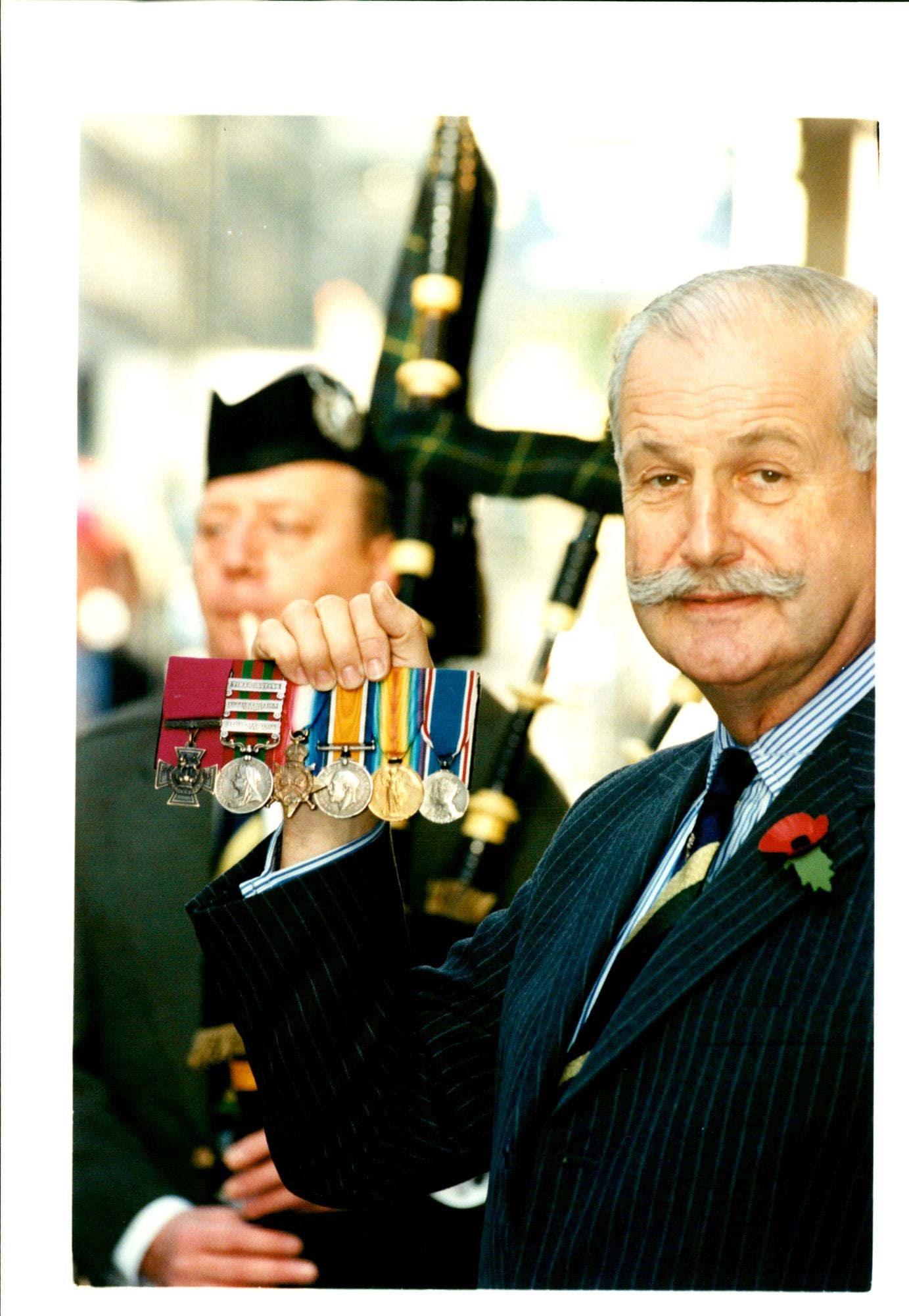 Sir Peter Graham shows the medals of George Findlater - Vintage Photog