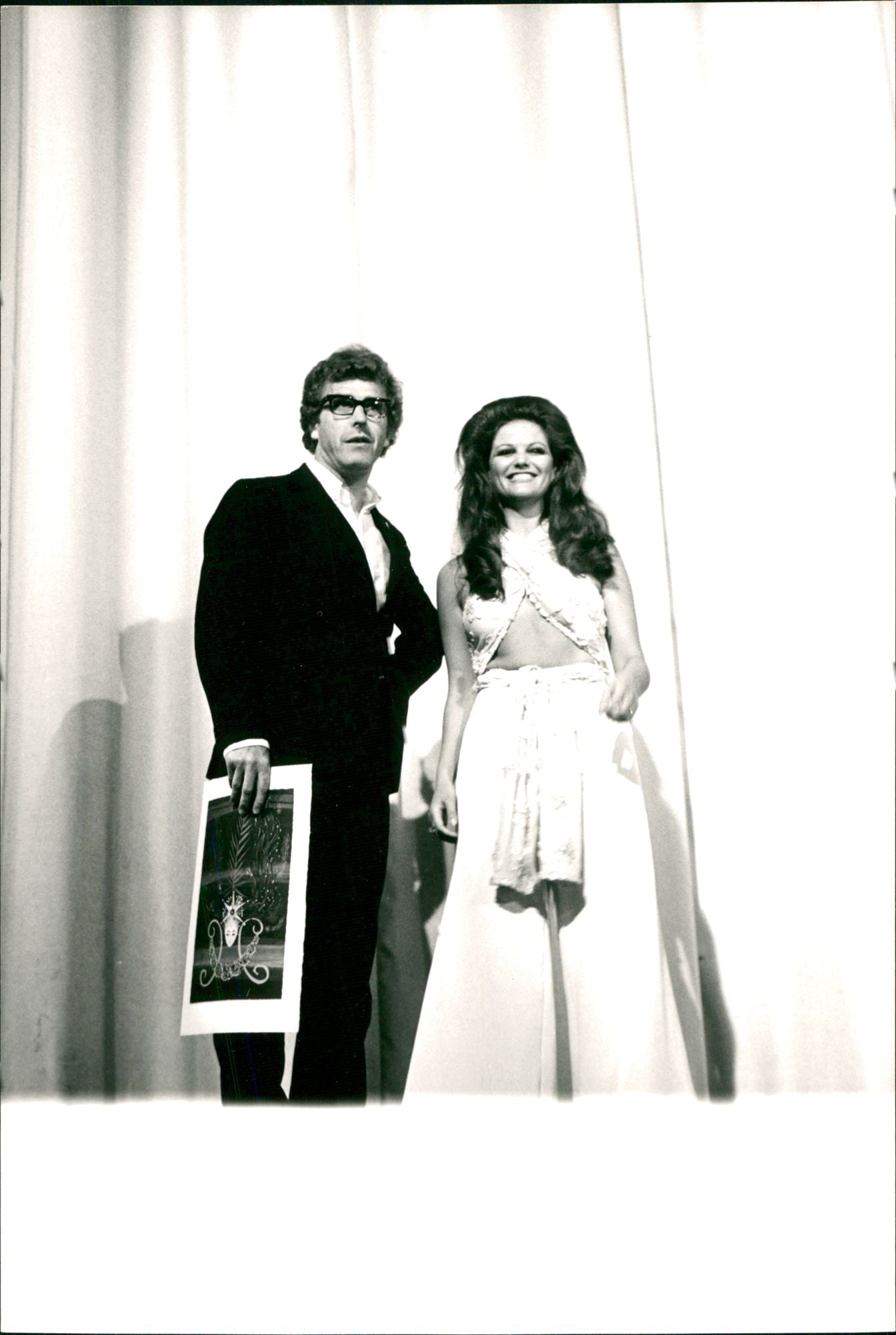 Swedish film director Bo Widerberg with Claudia Cardinale at the Canne