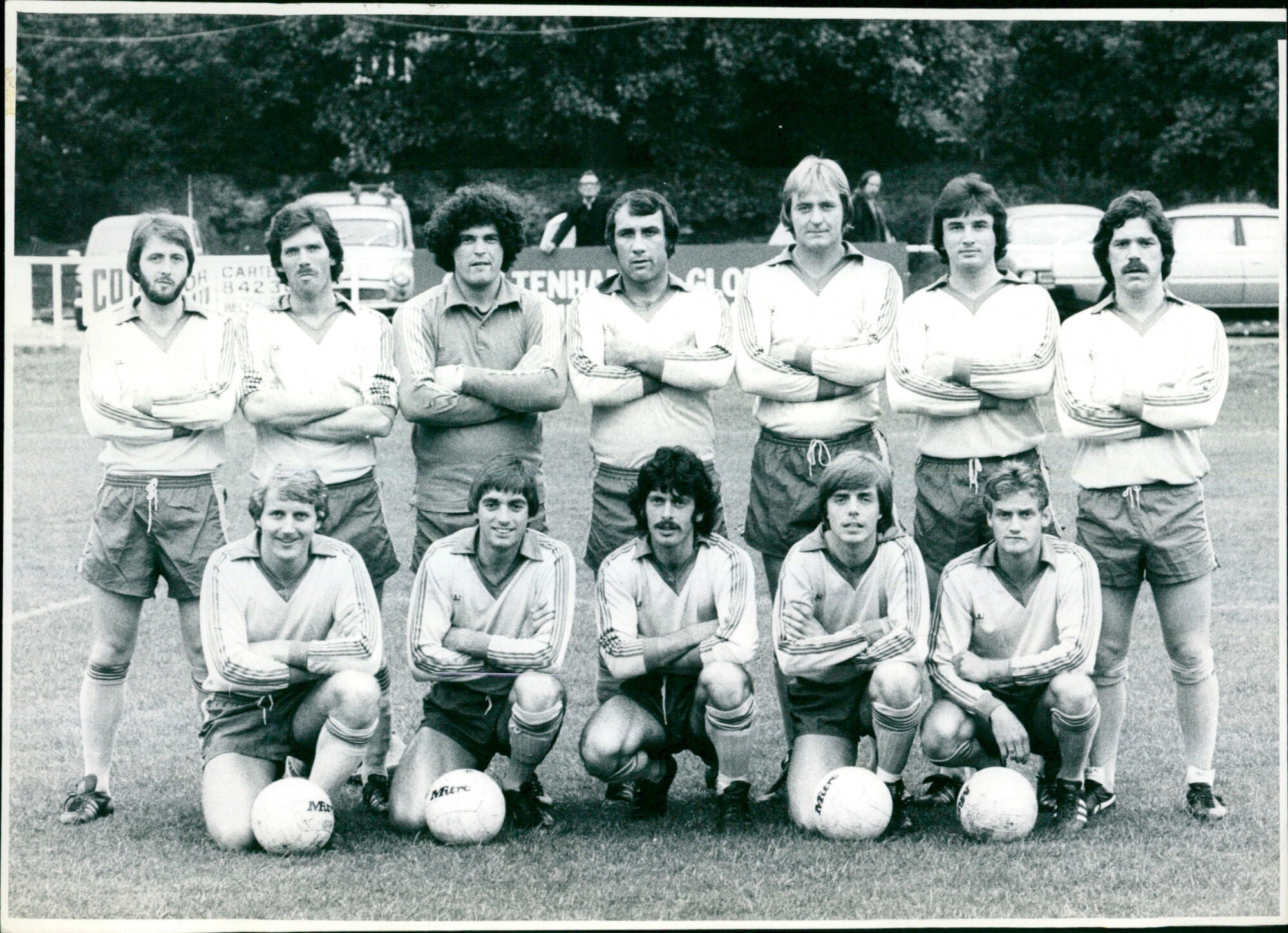 Witney Town football team poses for a photo at their training ground i
