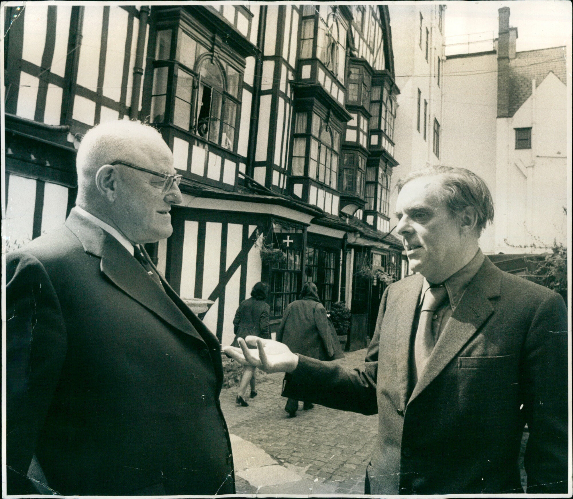 Author John Wain poses with his book "Where the Rivers Meet" at the Ox