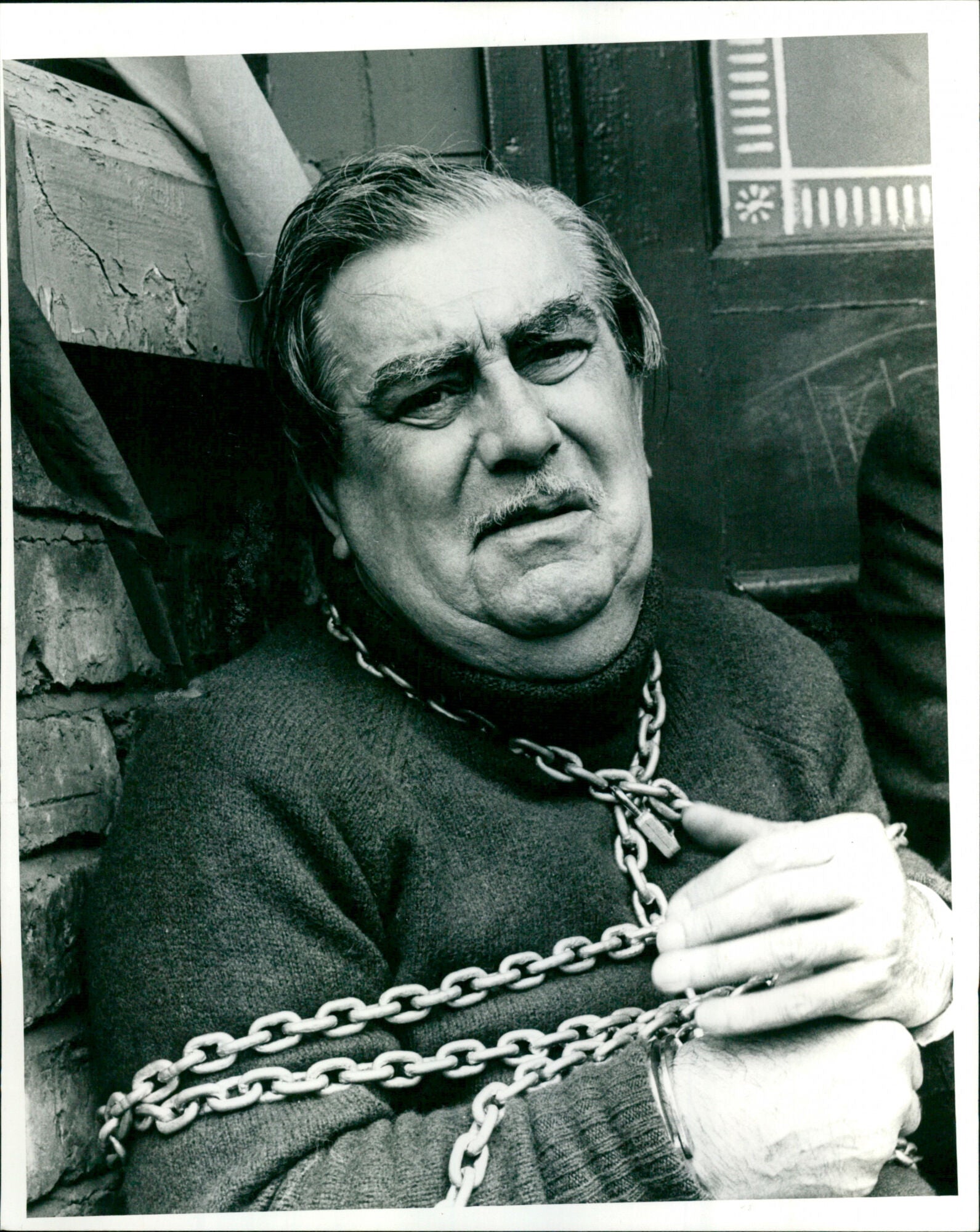 Bernard Youens performs an escapology trick on the set of "Coronation