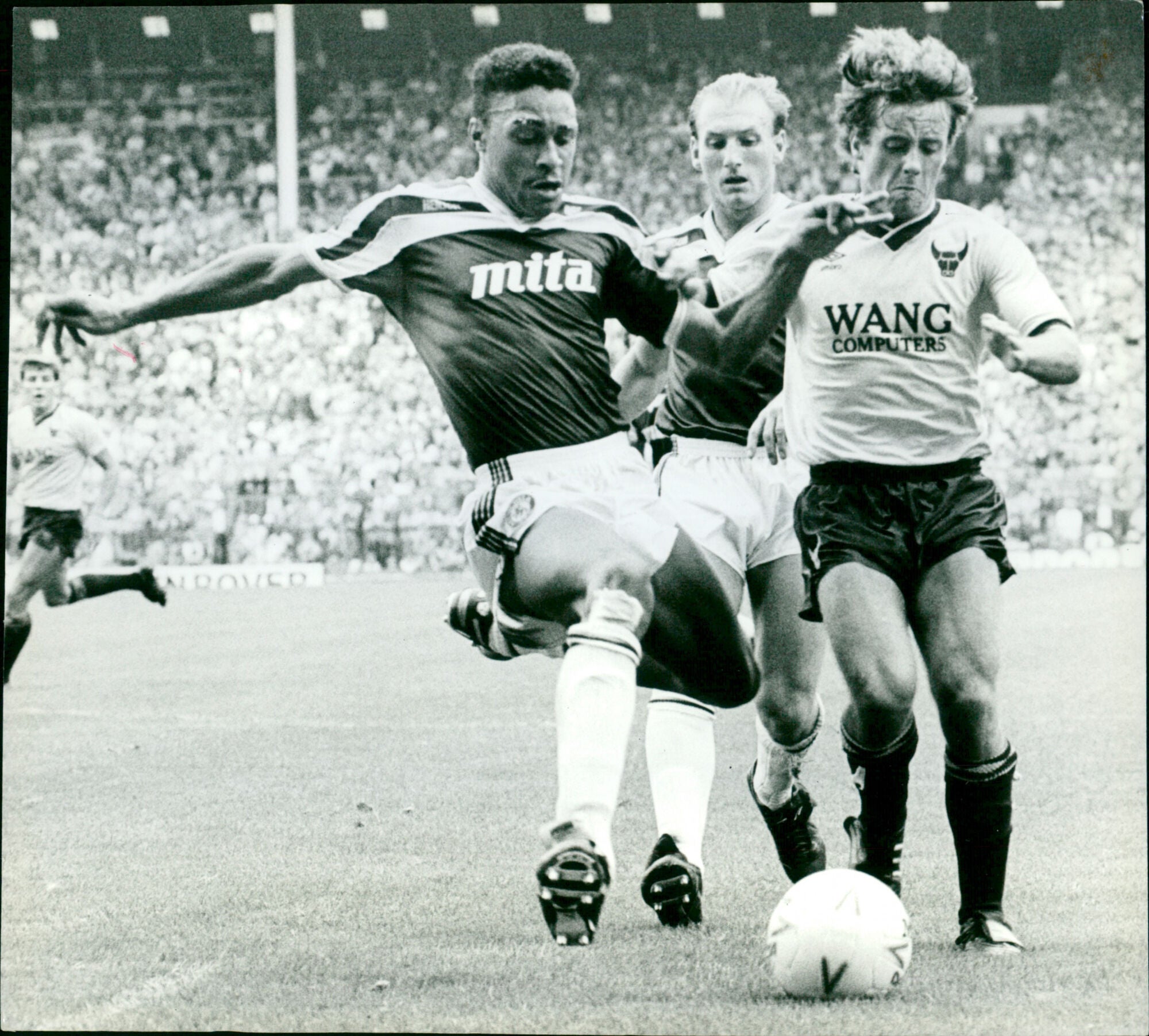 Midfielder Les Phillips of Roved Mita Wang Computers sprints past Stev