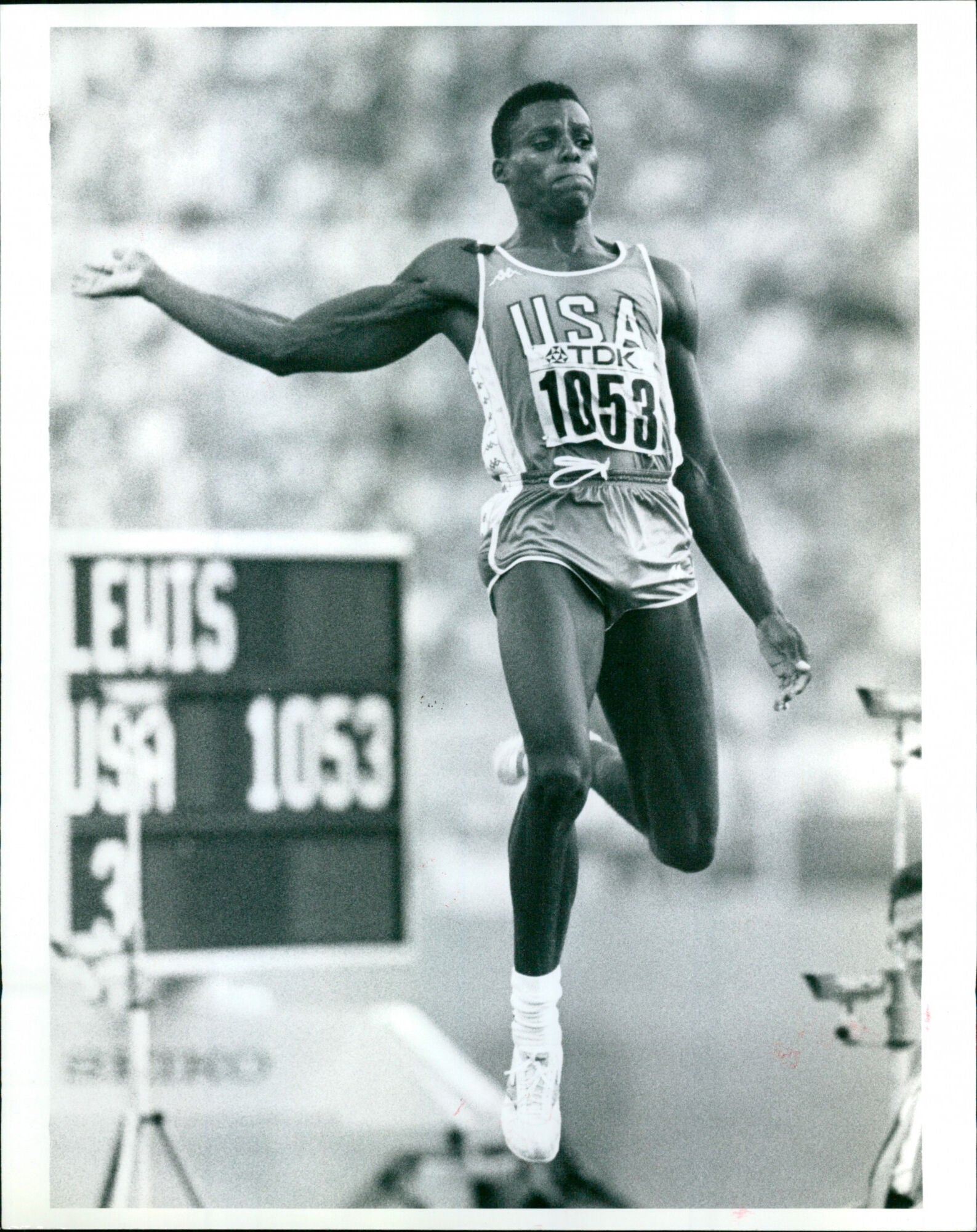 Olympic gold medalist Carl Lewis sprints during a competition in Oxfor