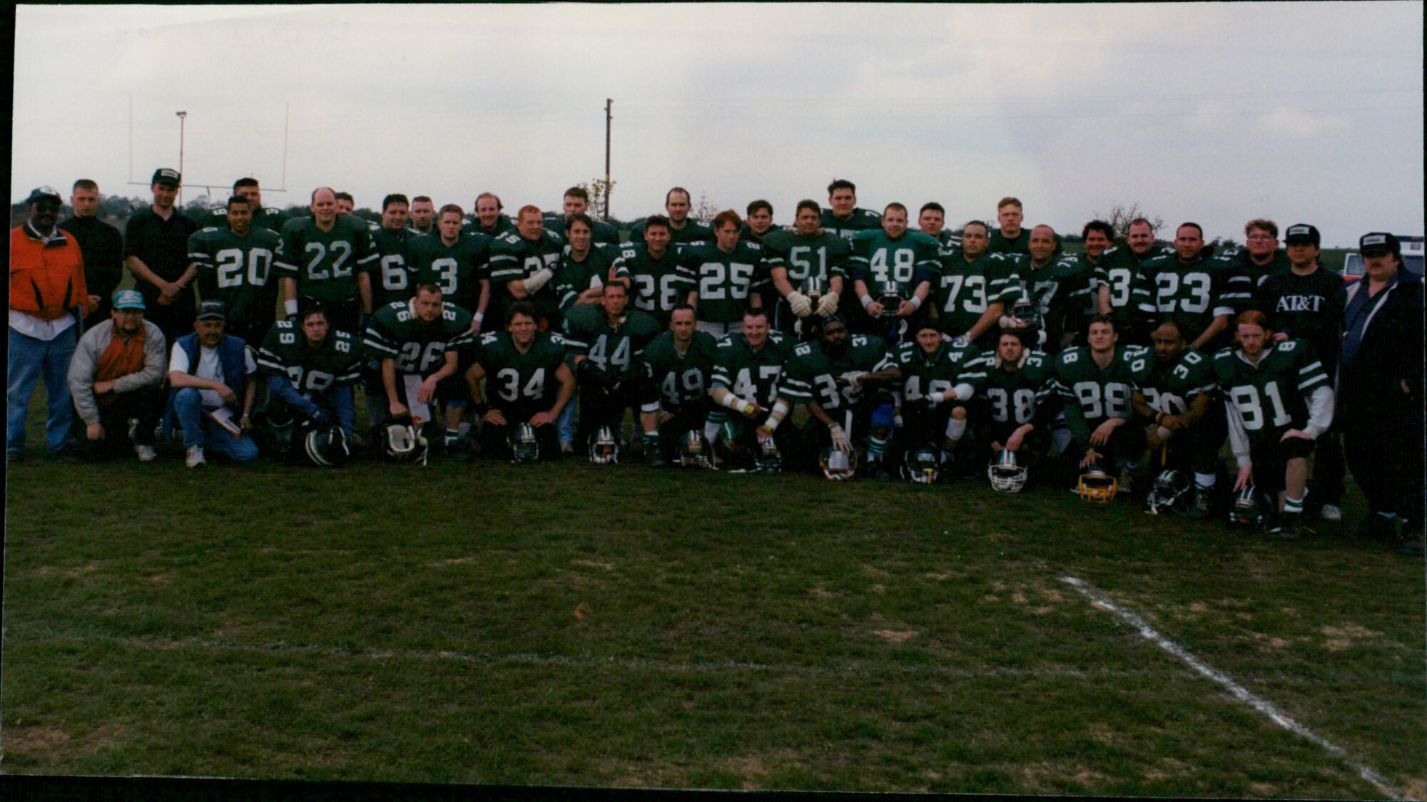 The Cartwright Wildcats Football team poses for a team photo. - Vintag