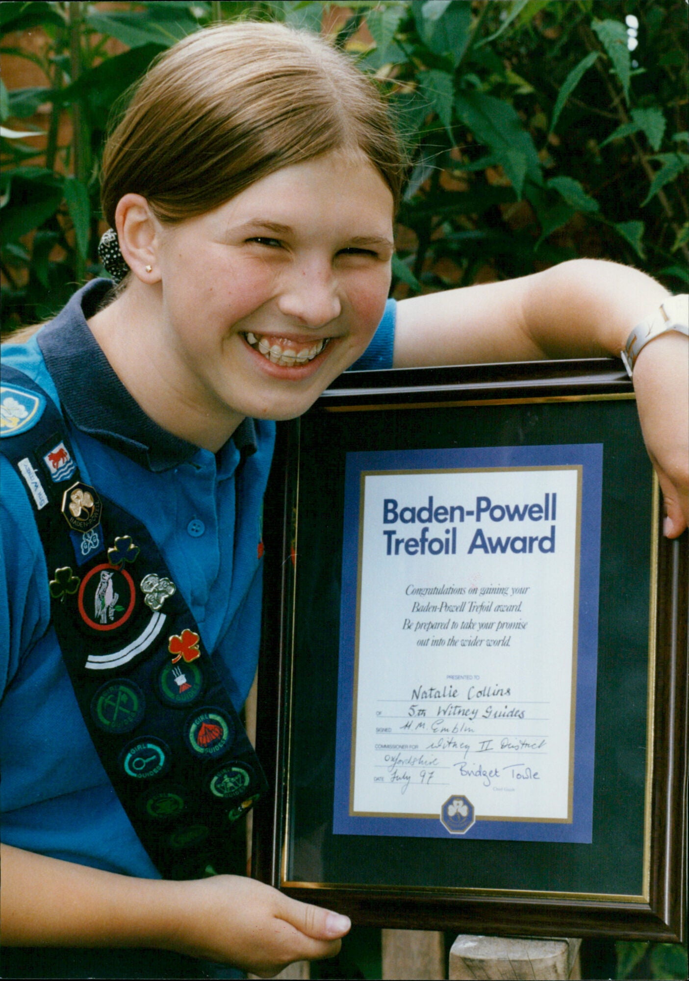 Girl Guide Natalie Collins receives her Baden-Powell Trefoil Award.
