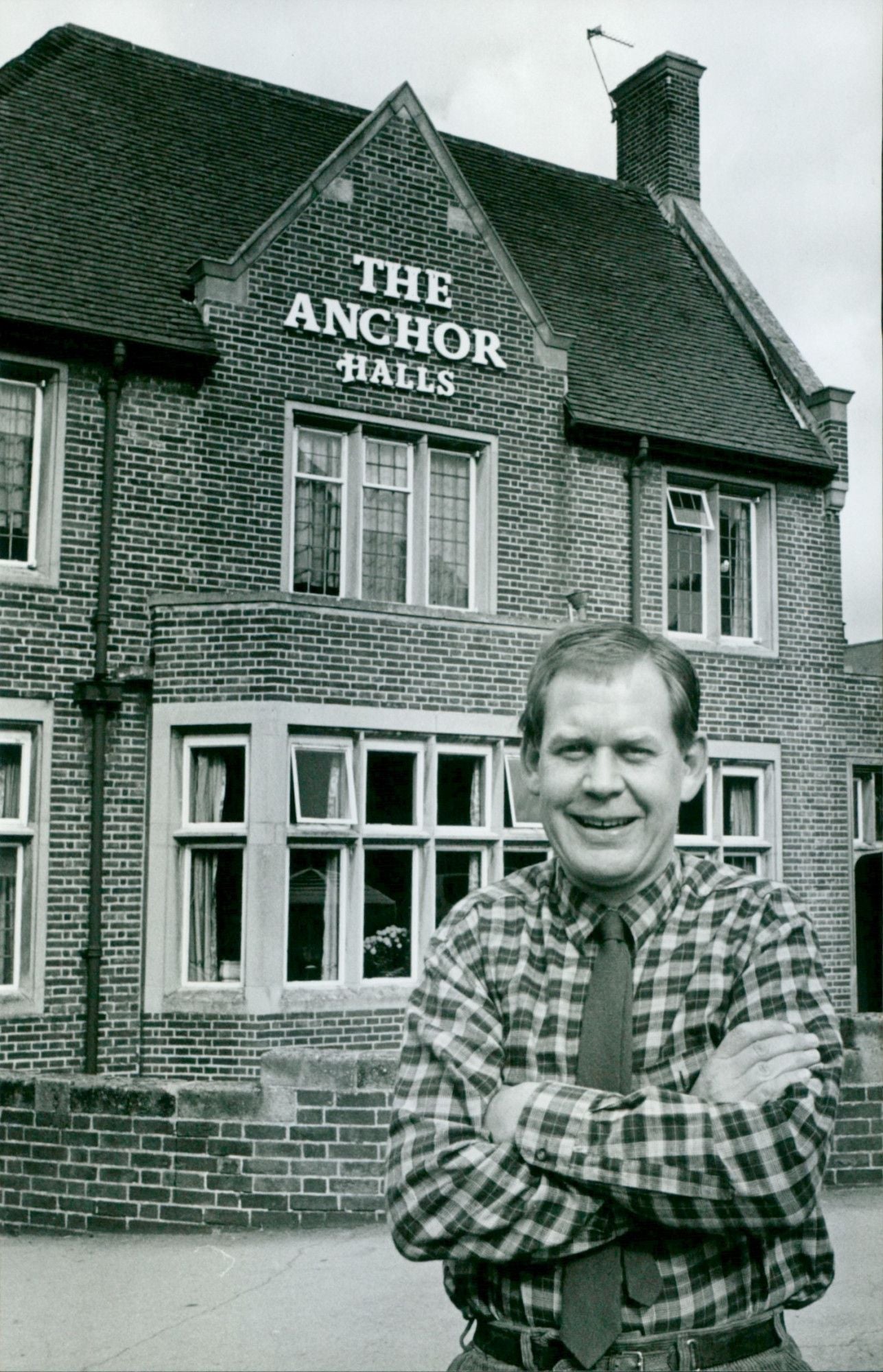 Charles Cassidy, the landlord at The Anchor in Kingston Road, stands i