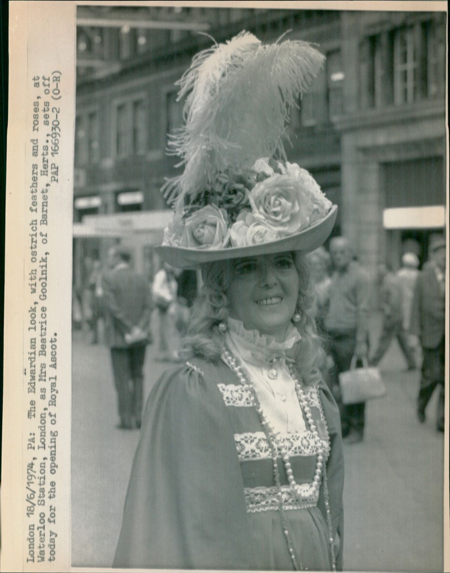 Mrs Beatrice Goolnik wearing an Edwardian-style outfit at Waterloo Sta