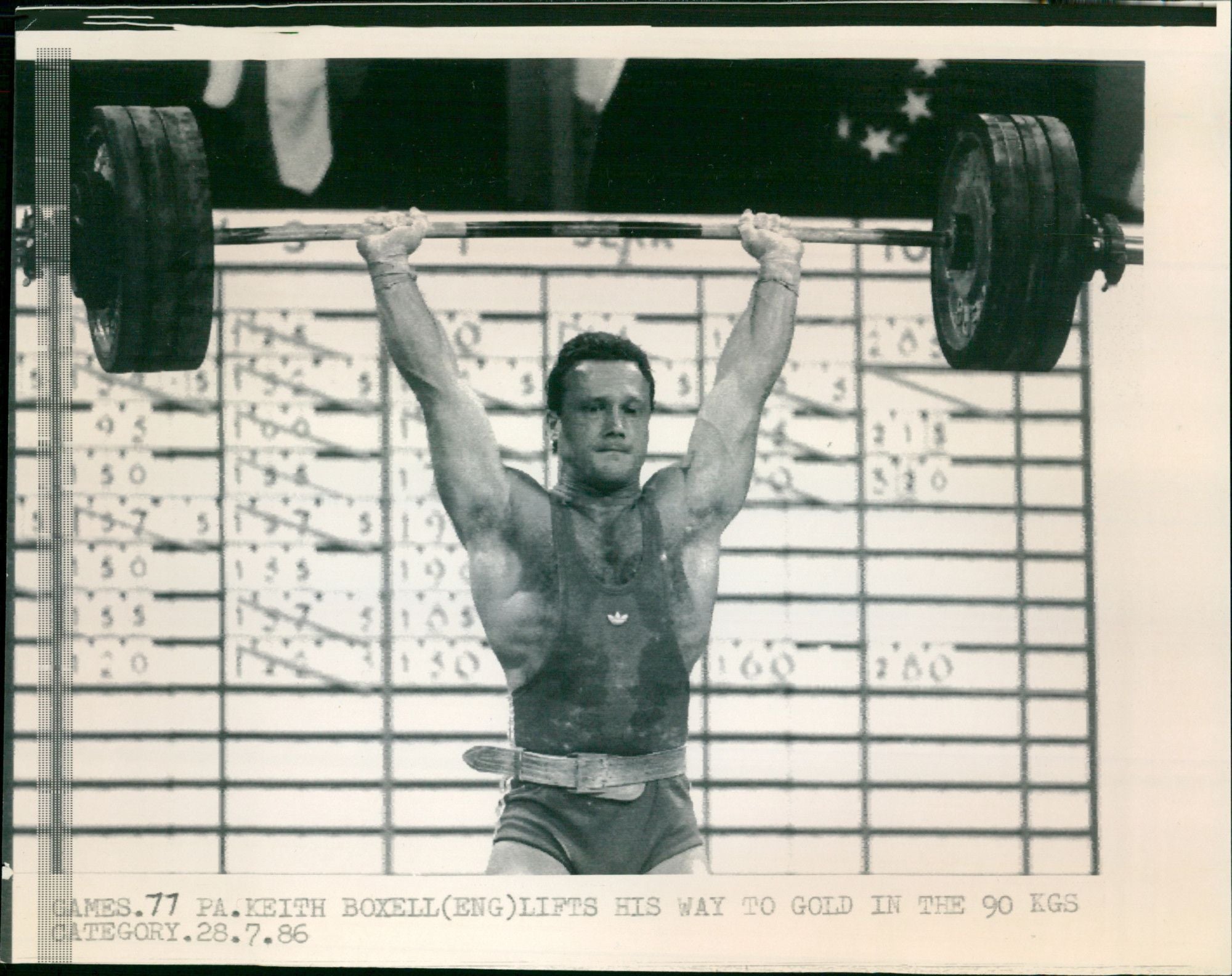 Keith Boxell of England celebrates winning the gold medal in the 90 kg