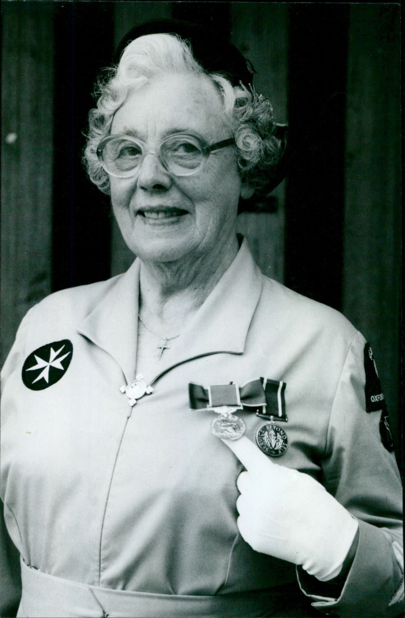 Mrs. Margaret Edmonds receives the British Empire Medal from the Lord