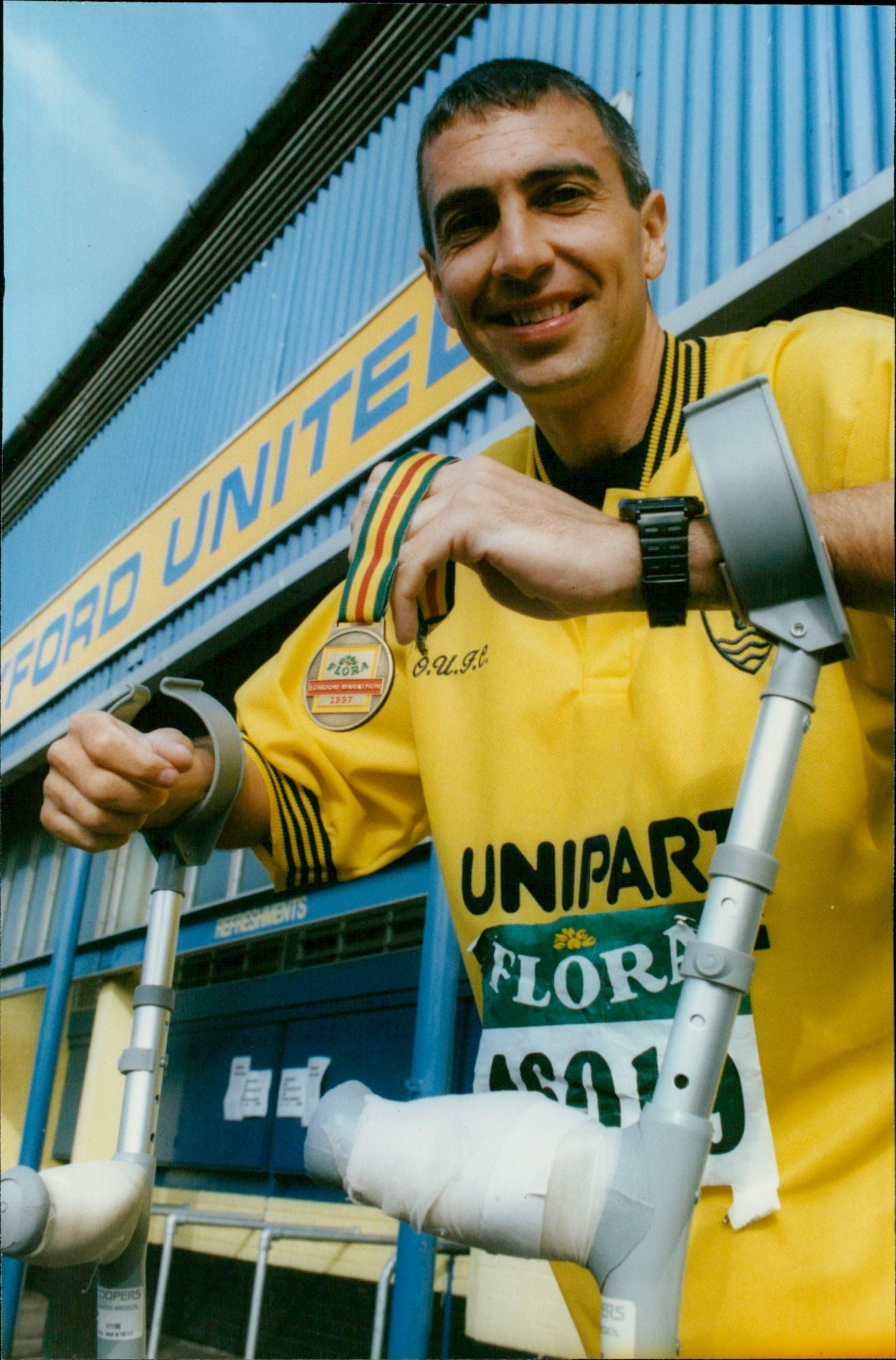 Peter Rhoades-Brown, Oxford United Community Officer, poses with his m