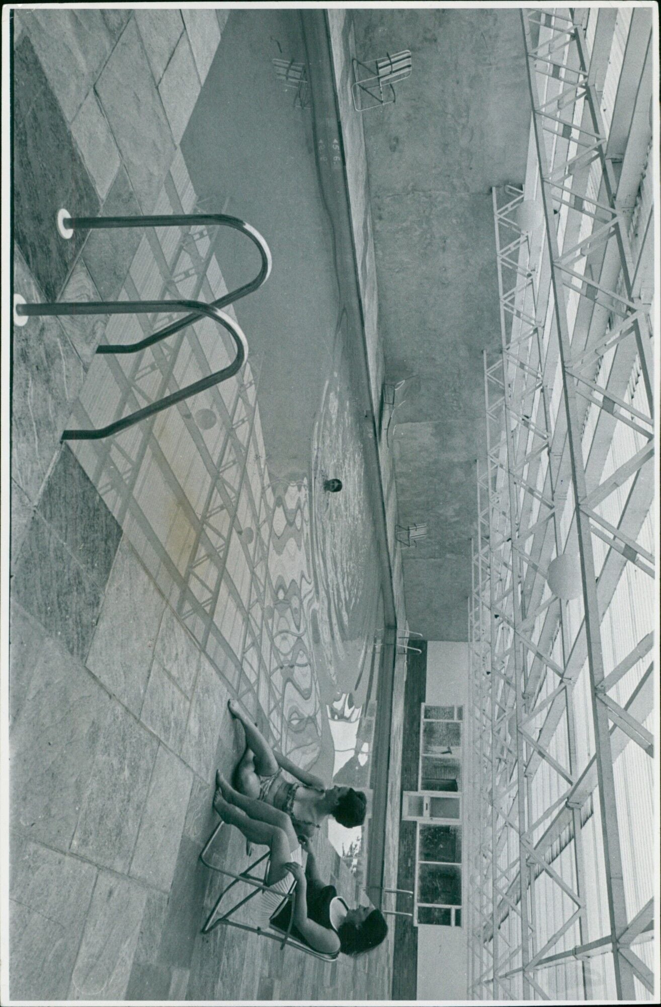 A swimmer dives into a pool on September 7th, 1970. - Vintage Photogra