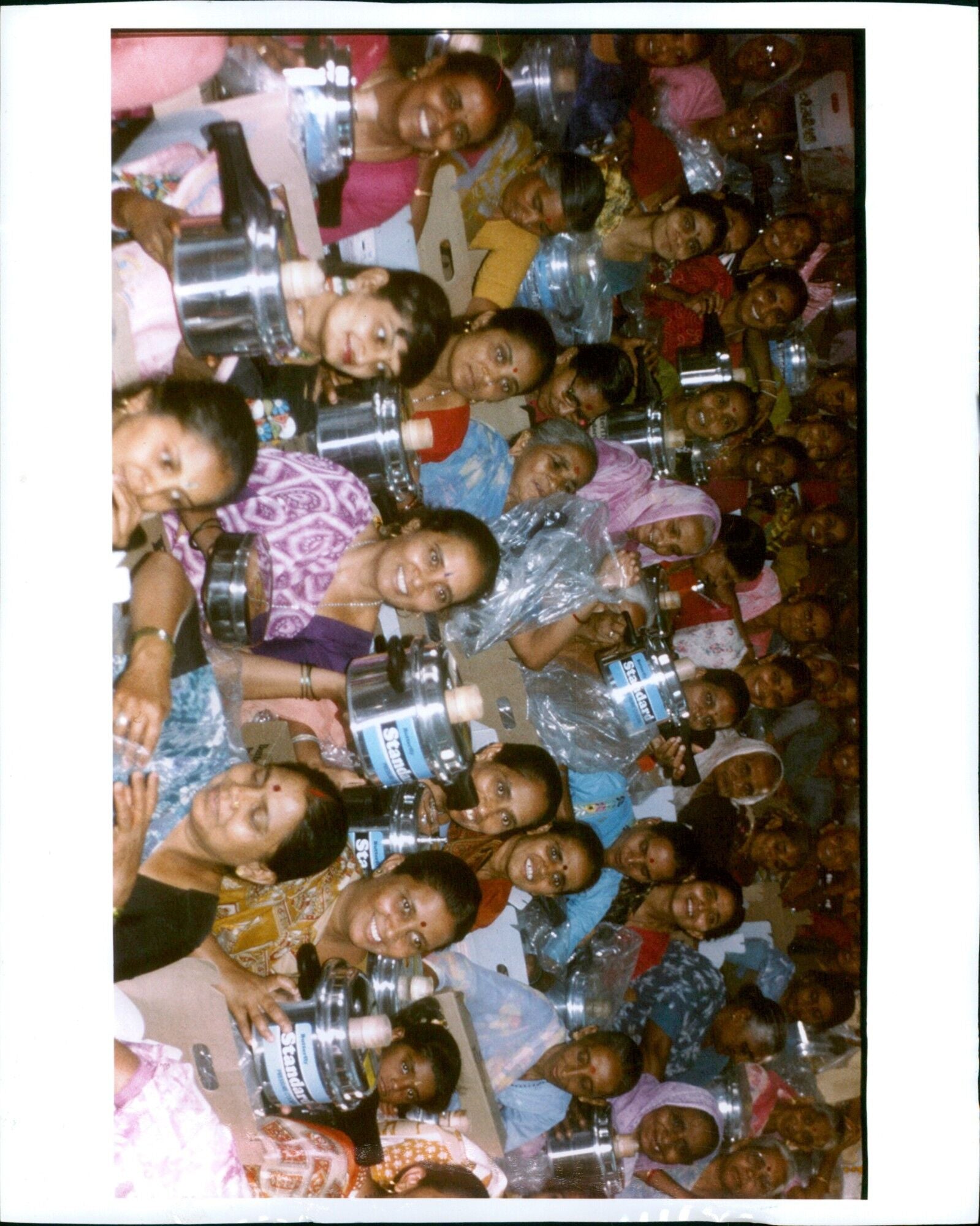 Members of an embroidery group in India pose for a photograph. - Vinta