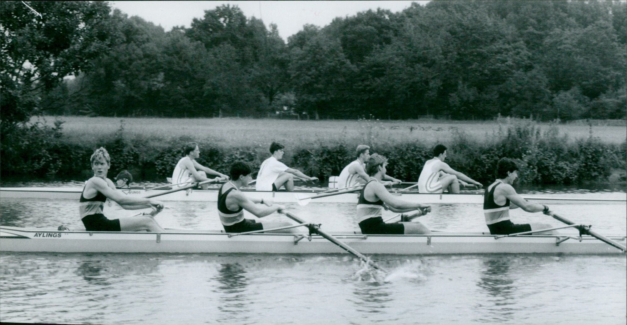 A team of rowers from Abingdon School celebrates winning the National