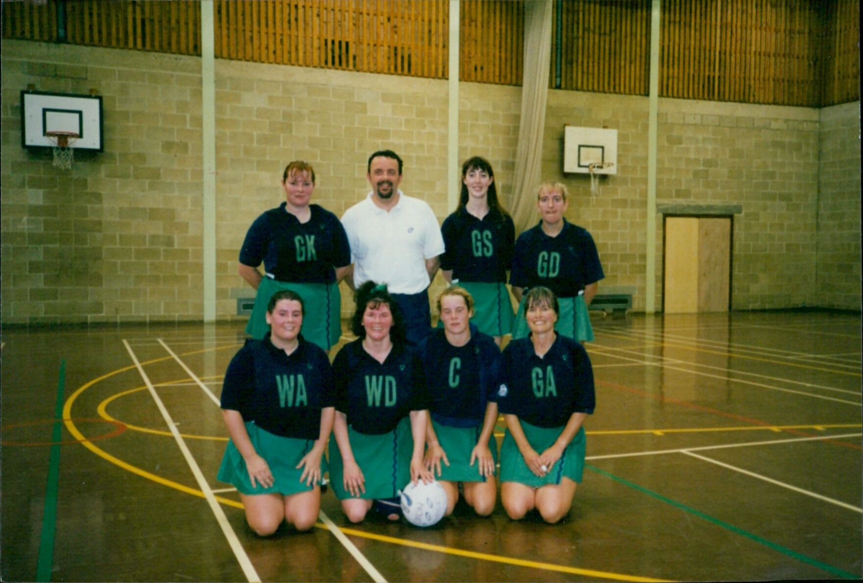 Oxfordshire Senior Squad pose for a photo at a netball match. - Vintag