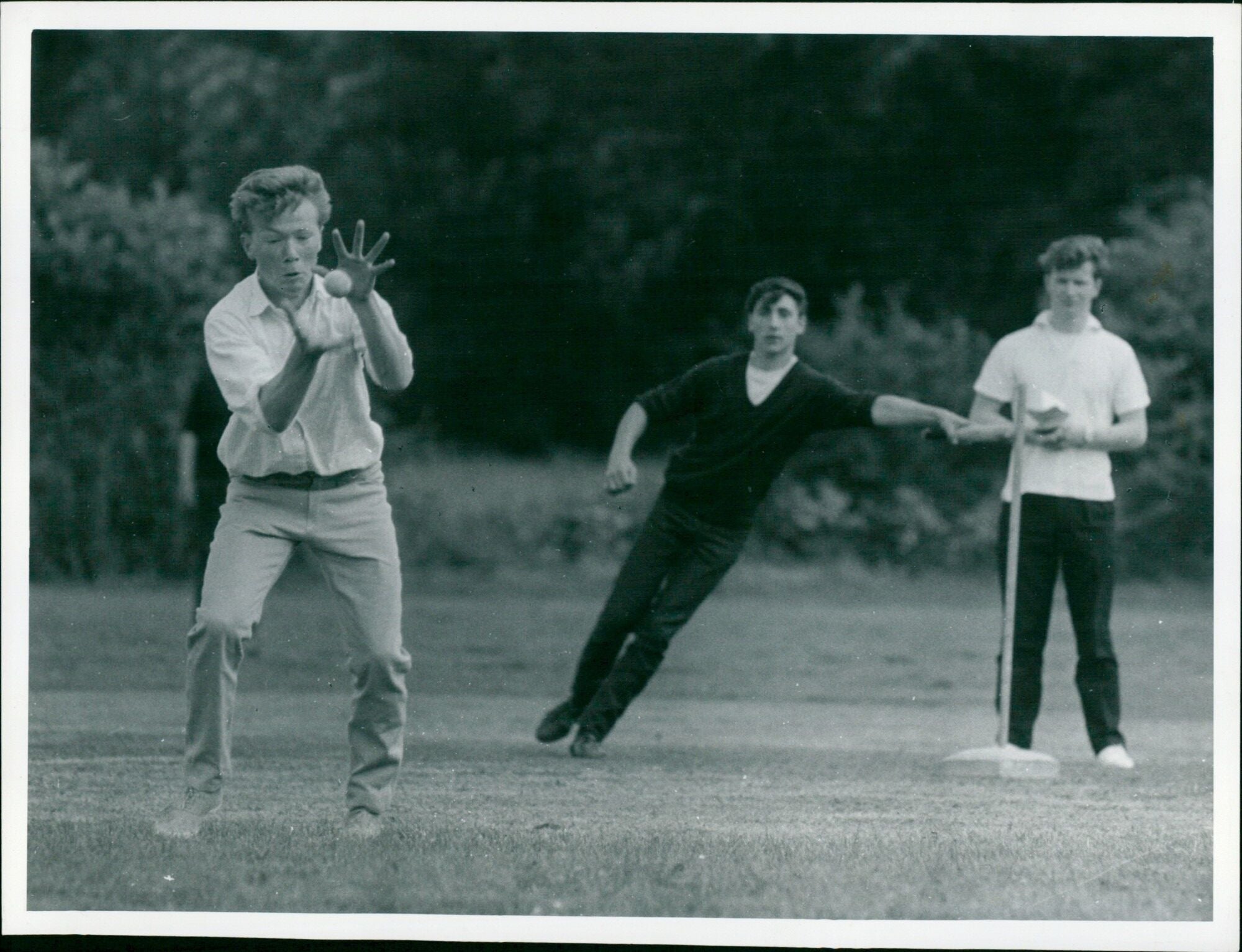 Teenagers play a game of Rounders in July 1963. - Vintage Photograph