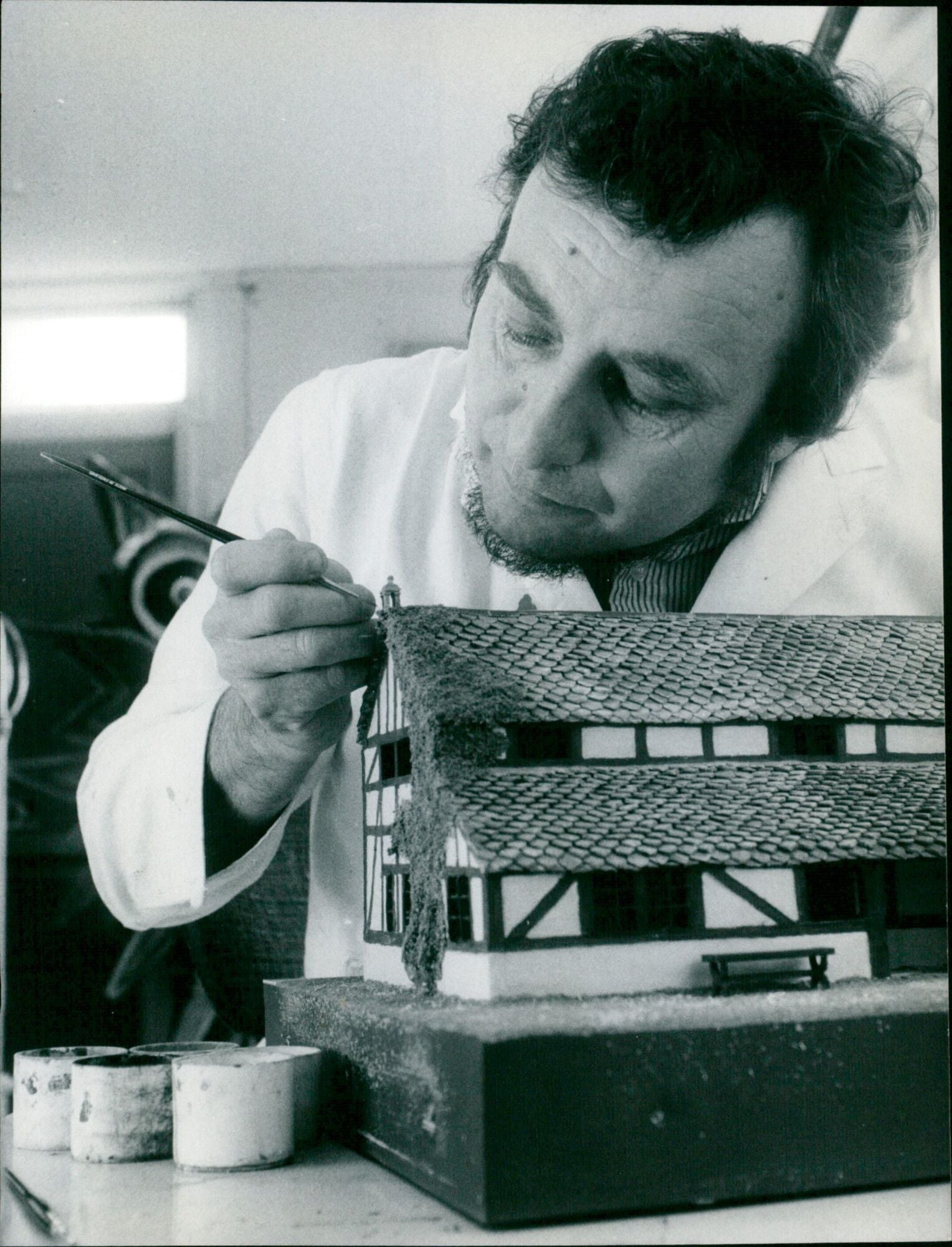 Rod James works on a model of a Roman villa at Barton Court Farm in Ab