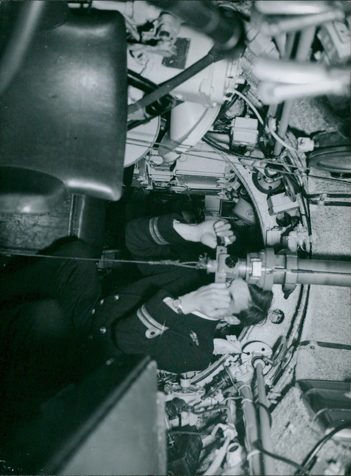 Lt. Much T. Plity of the Royal Navy operates the periscope of his subm