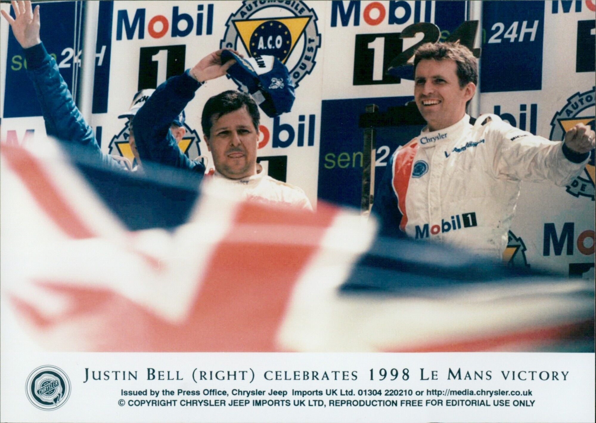 Racecar driver Justin Bell celebrates his victory at Le Mans in 1998.