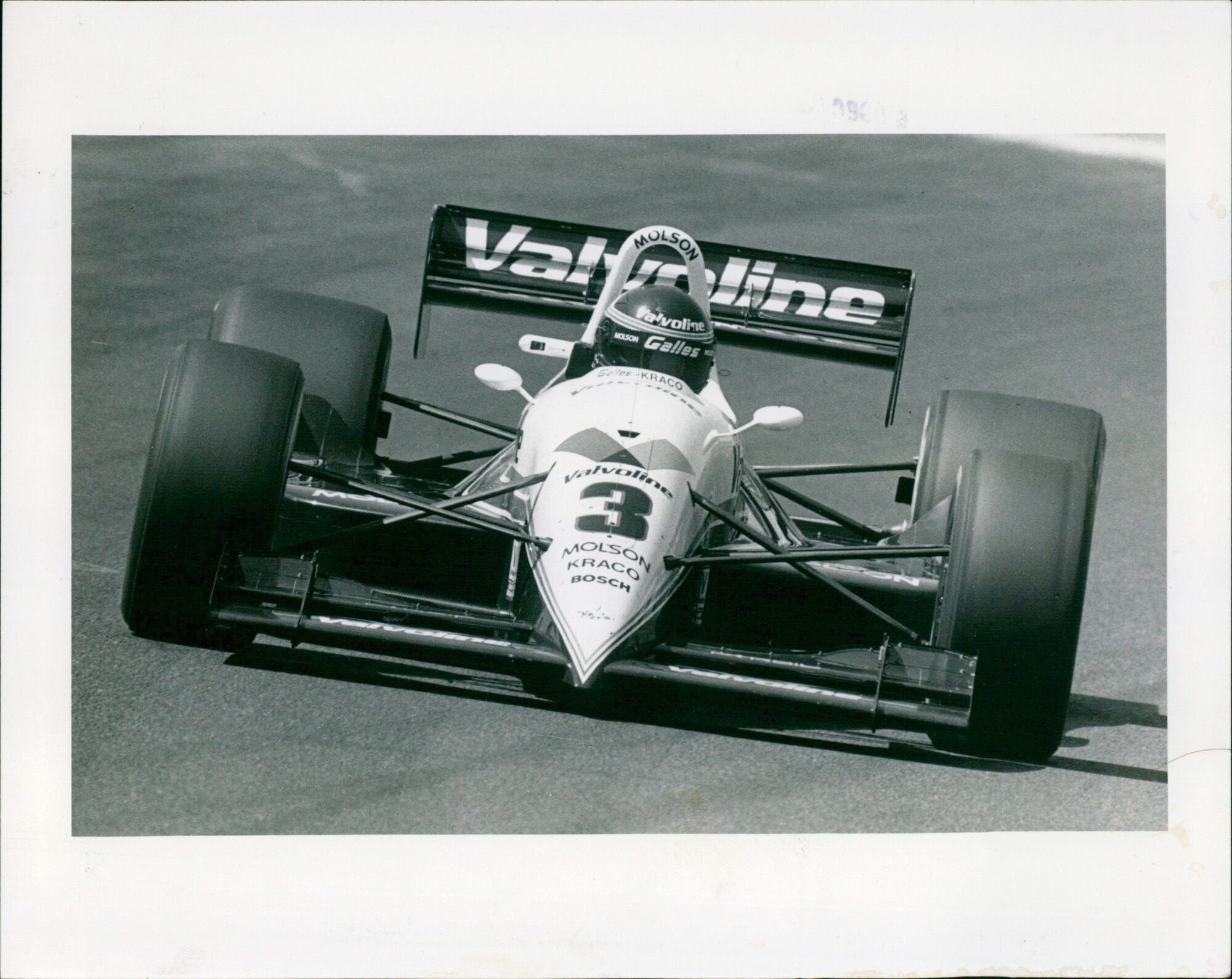 Al Unser Jr. poses with the Galmer G92 car he drove to victory in the