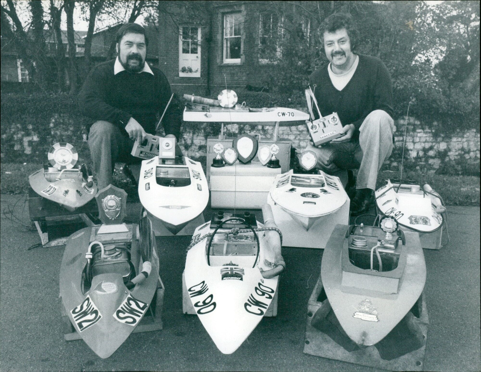 Don Willis and Len Thomas proudly display their radio-controlled racin