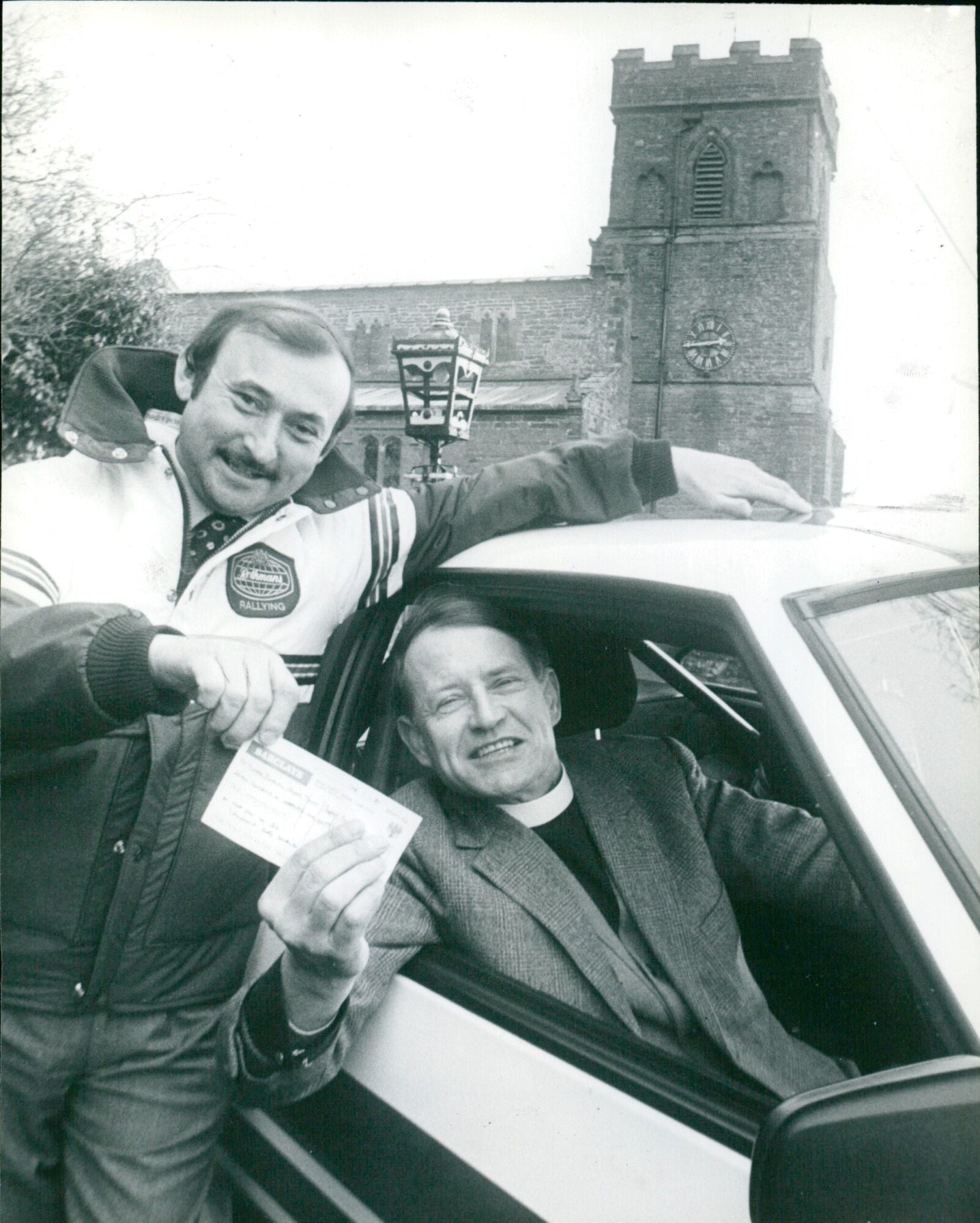 Reverend Robert Lee receives a 7800 cheque from Mr Tony Mason at Moret