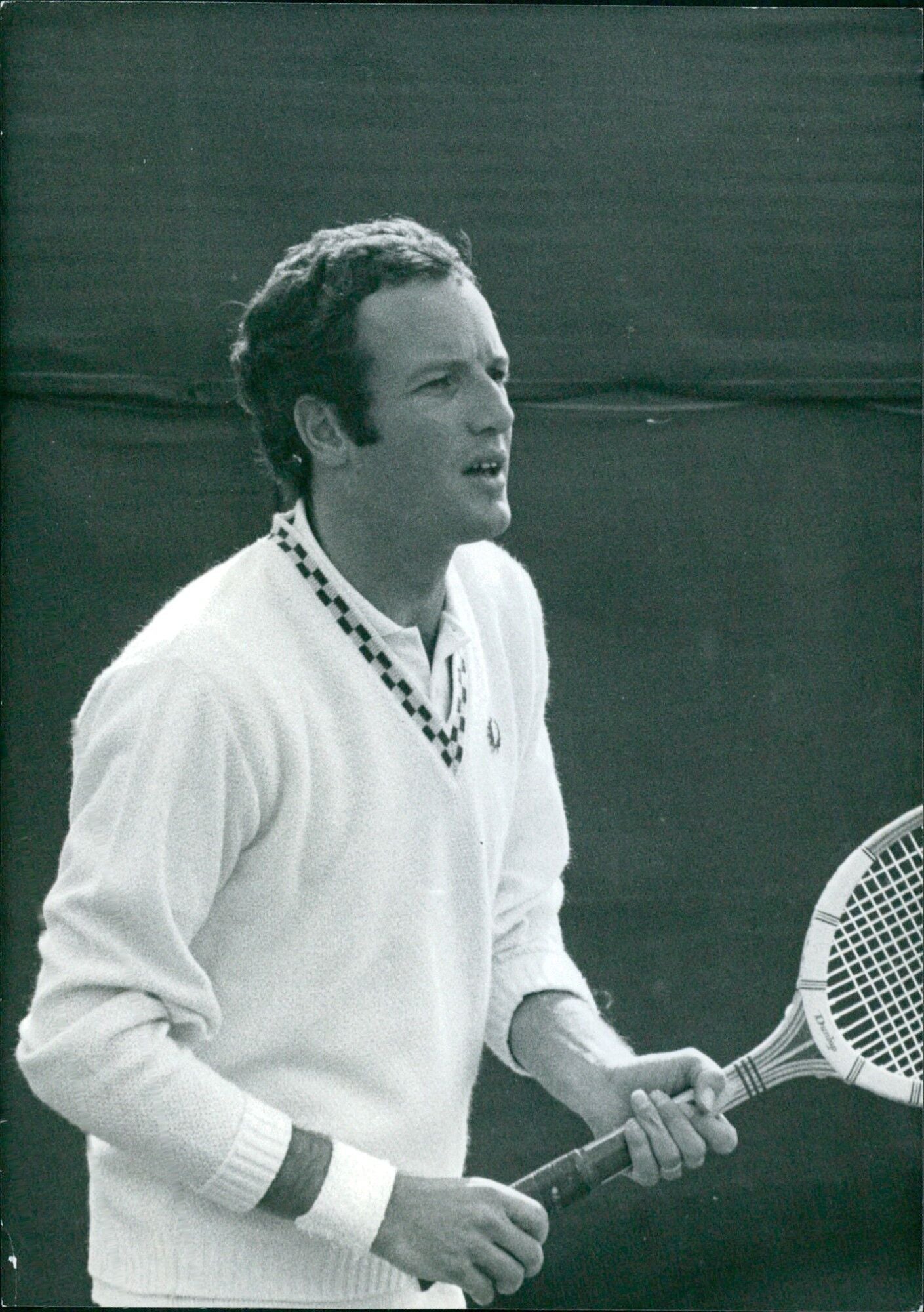 Tom Okker, nicknamed the "Flying Dutchman", poses after winning multip