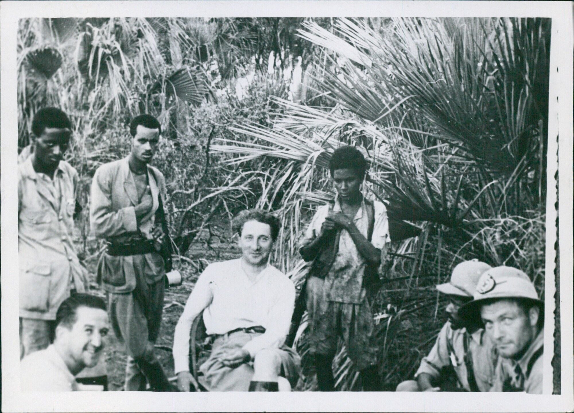 Members of the Swedish Red Cross and soldiers provide aid to a wounded