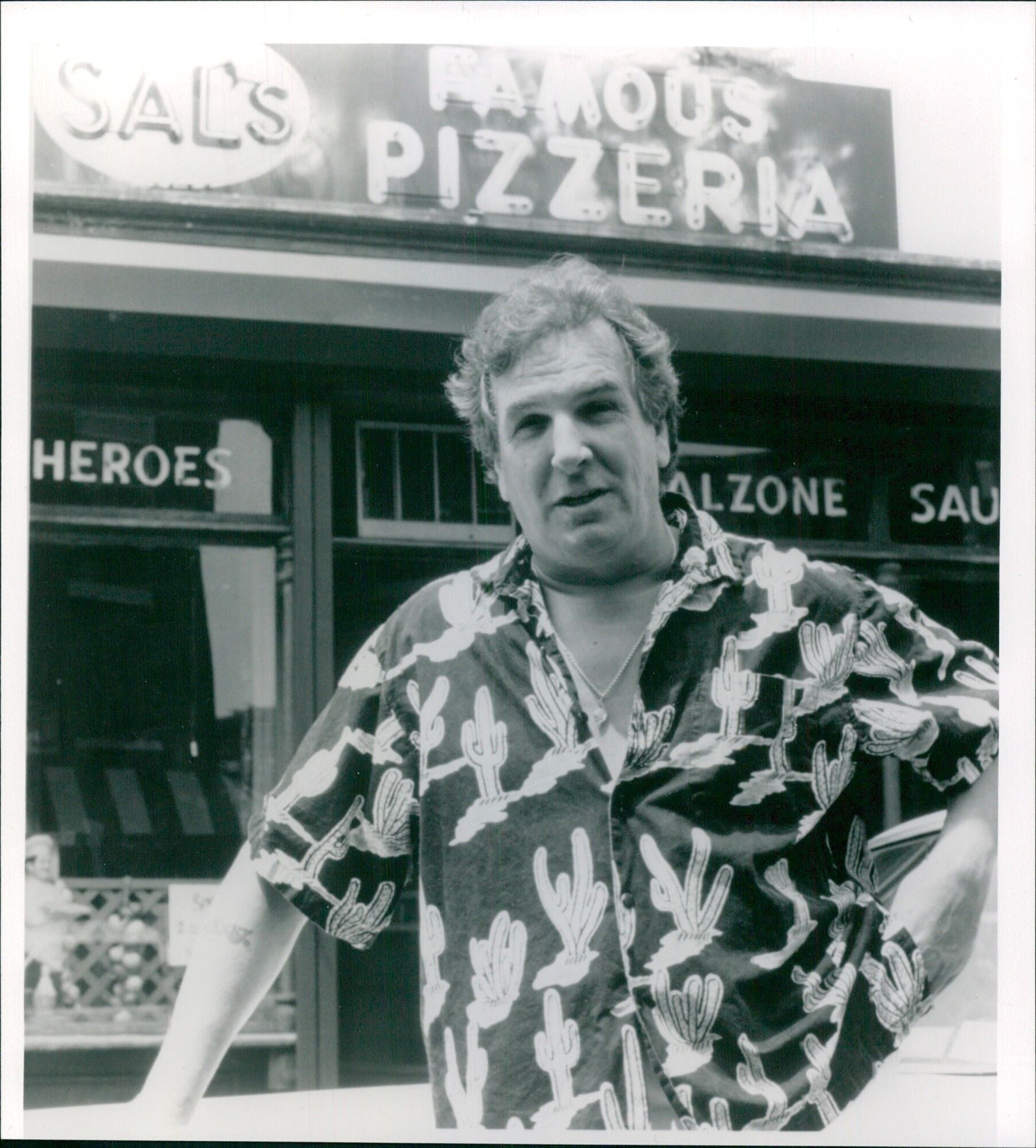 Actor Danny Aiello poses at Sal's Famous Pizzeria, the iconic restaura