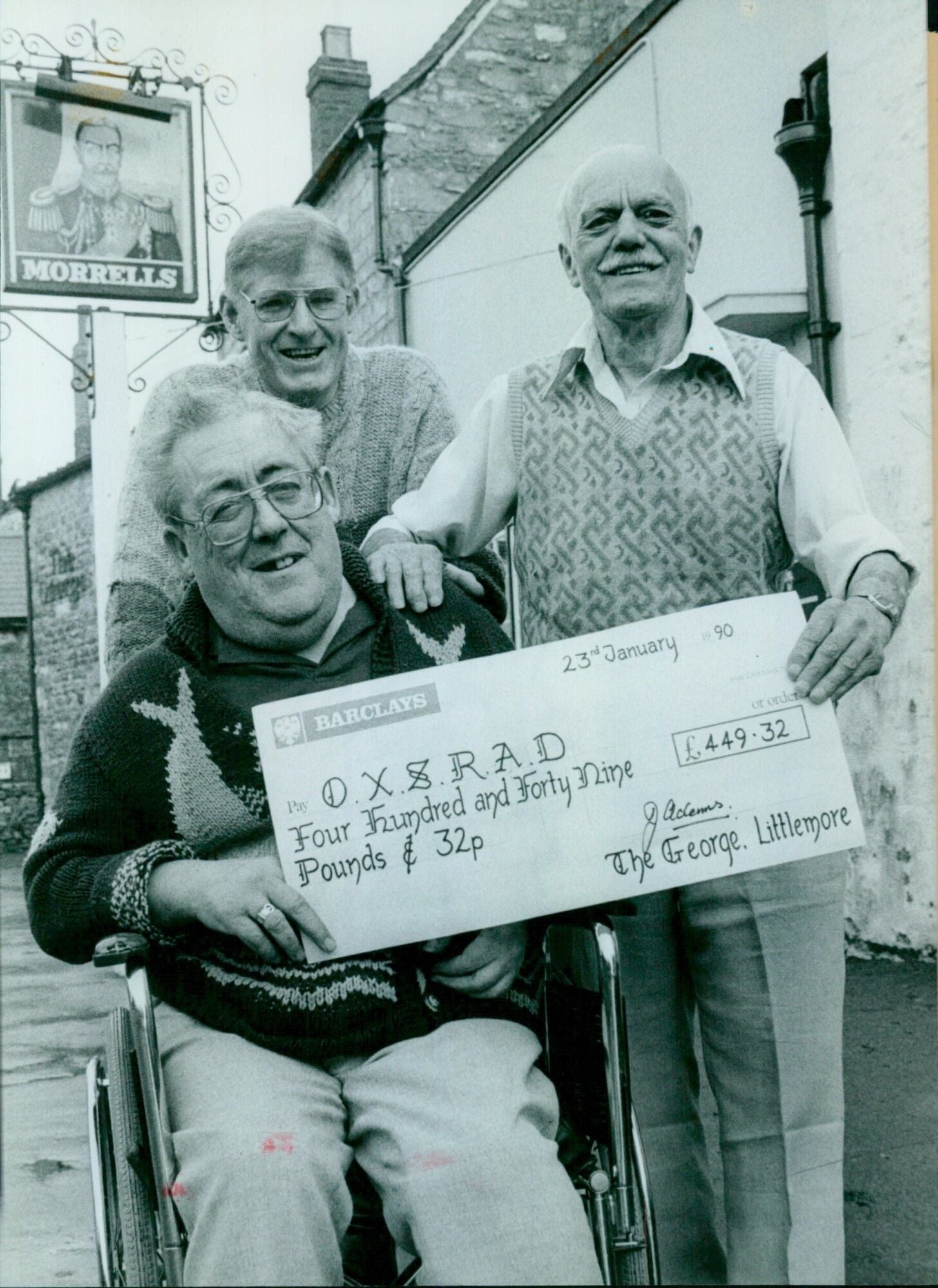 Regulars at The George, Littlemore present a cheque for £449.32 to mem
