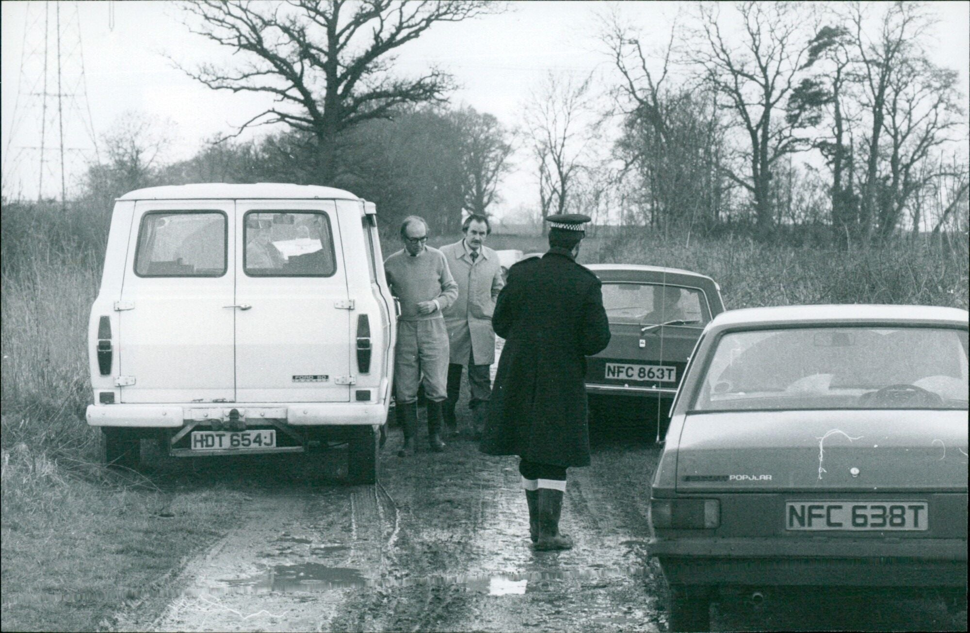 Pathologist and Detective Superintendent Lawson inspect a crime scene.