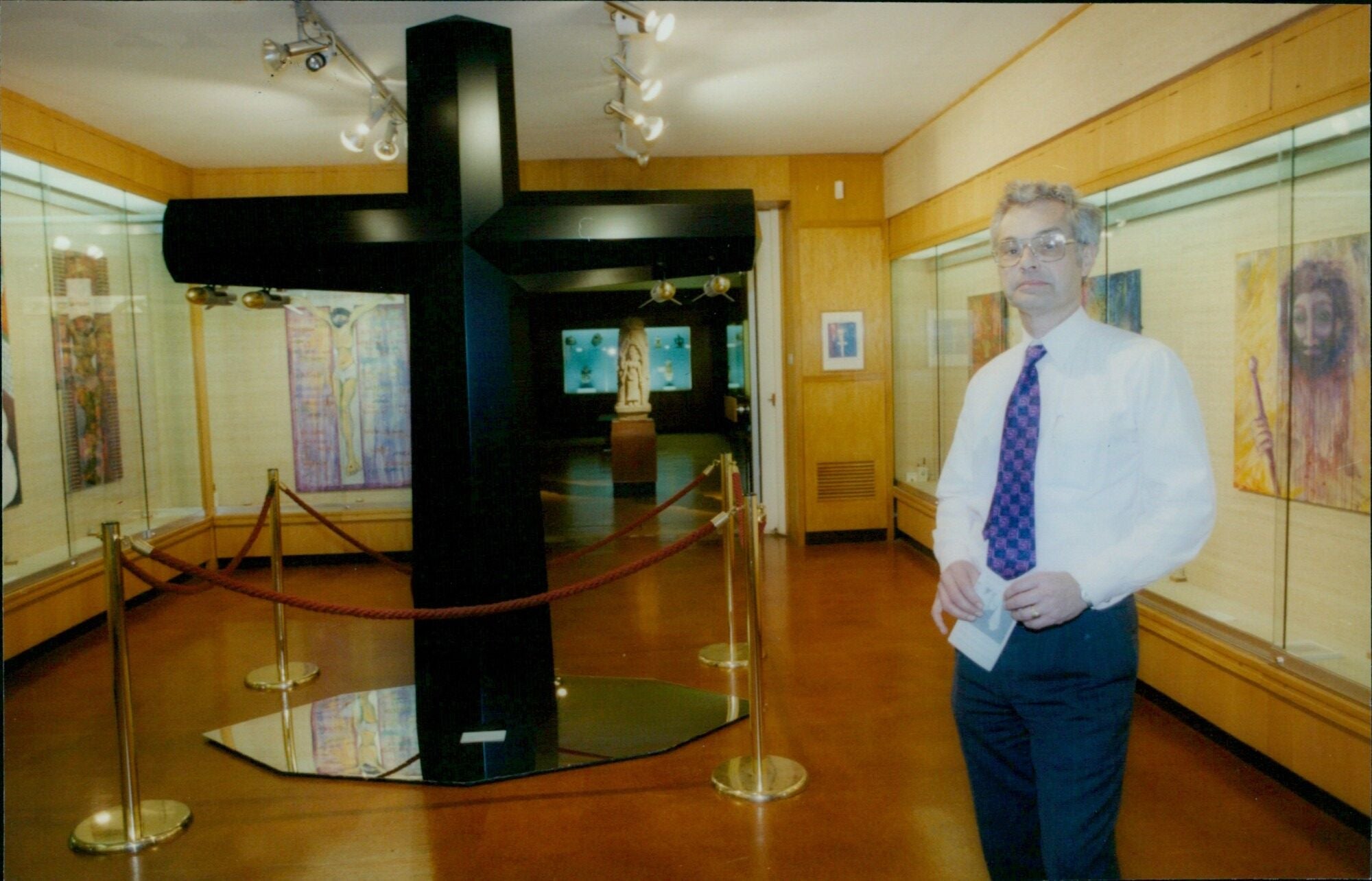 Prof. James Allan stands with the Transcontinental Millennium Cross in