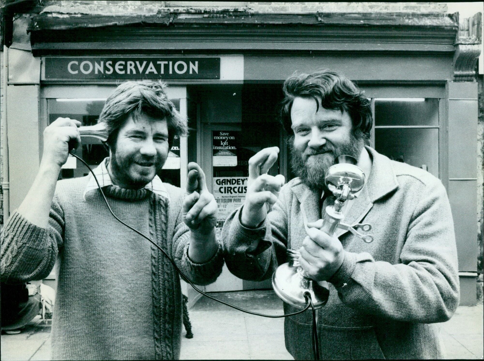 Loft insulators Barry Thomas and Tony Harding work hard to clear a bac